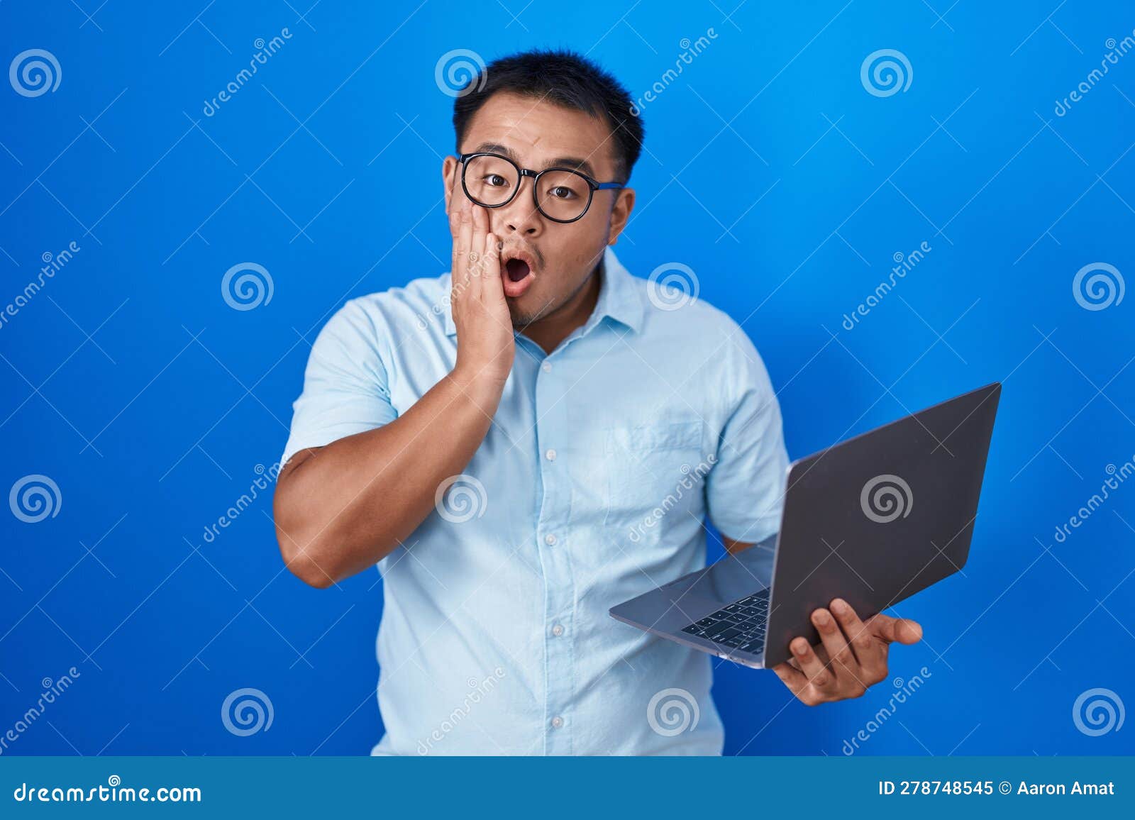 Chinese Young Man Using Computer Laptop Afraid and Shocked, Surprise ...