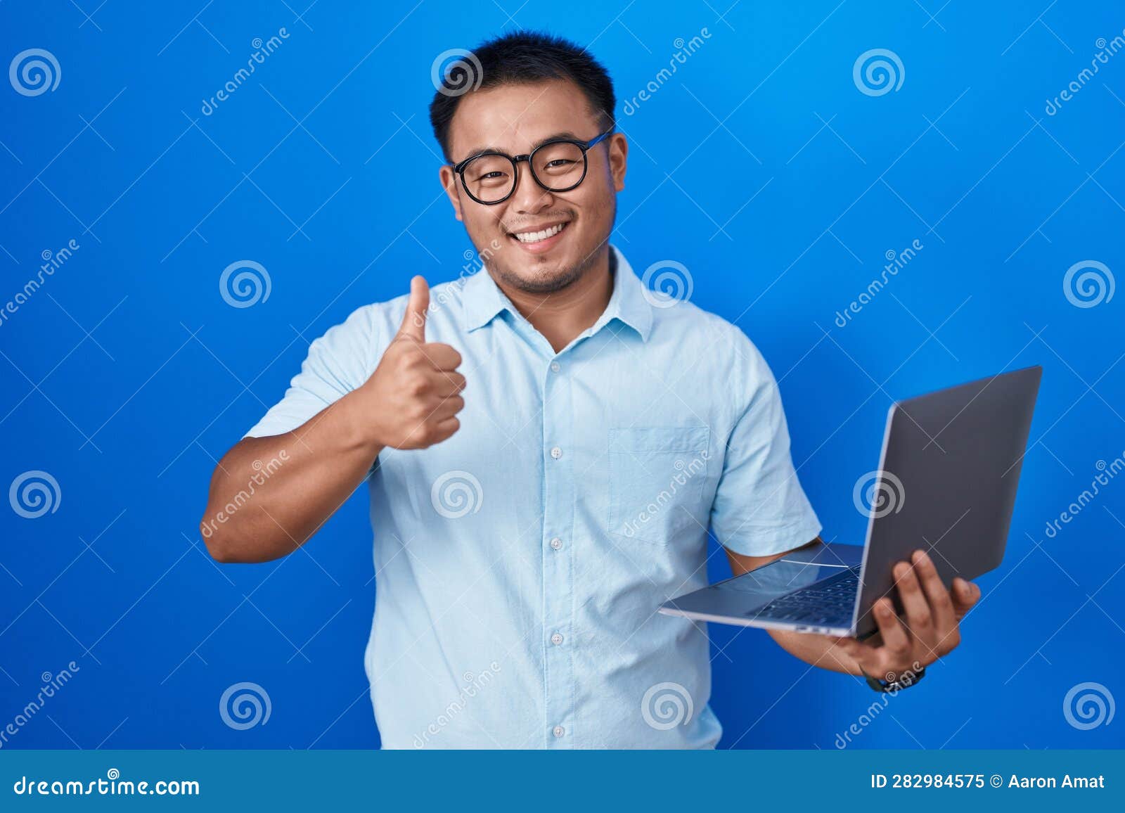 Chinese Young Man Using Computer Laptop Doing Happy Thumbs Up Gesture ...