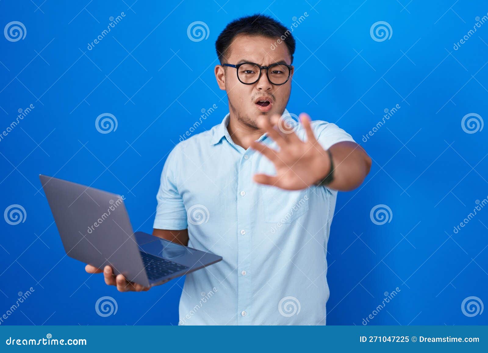Chinese Young Man Using Computer Laptop Doing Stop Gesture with Hands ...