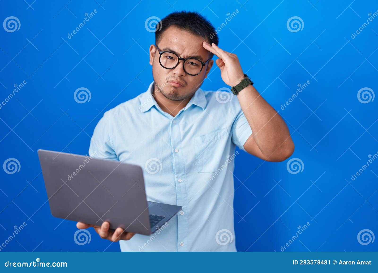 Chinese Young Man Using Computer Laptop Worried and Stressed about a ...