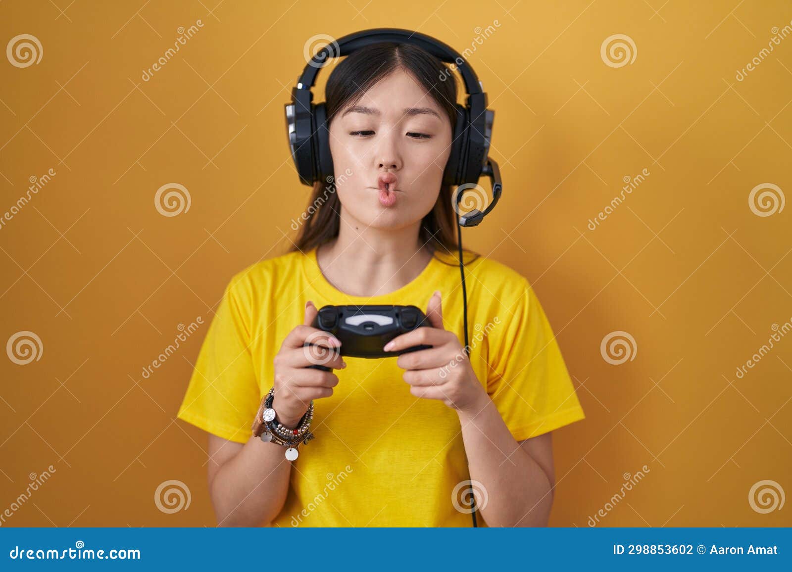 Chinese Young Woman Playing Video Game Holding Controller Making Fish ...