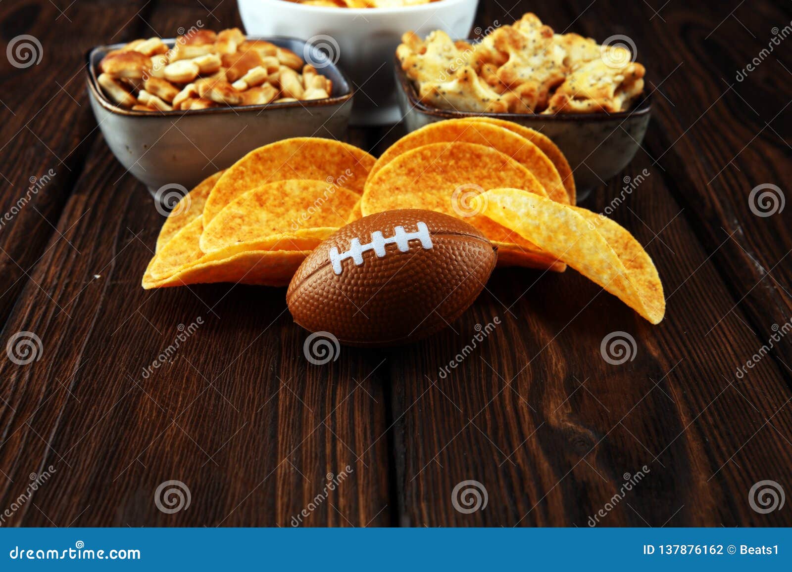 Chips, Salty Snacks, Football on a Table. Great for Bowl Game Stock ...