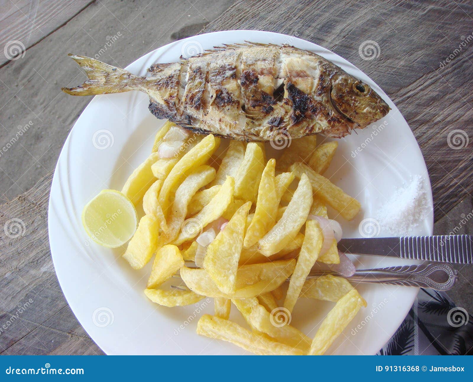 Chipsy Samaki Chips with Fried Fish and Salt on White Dish Stock Photo ...