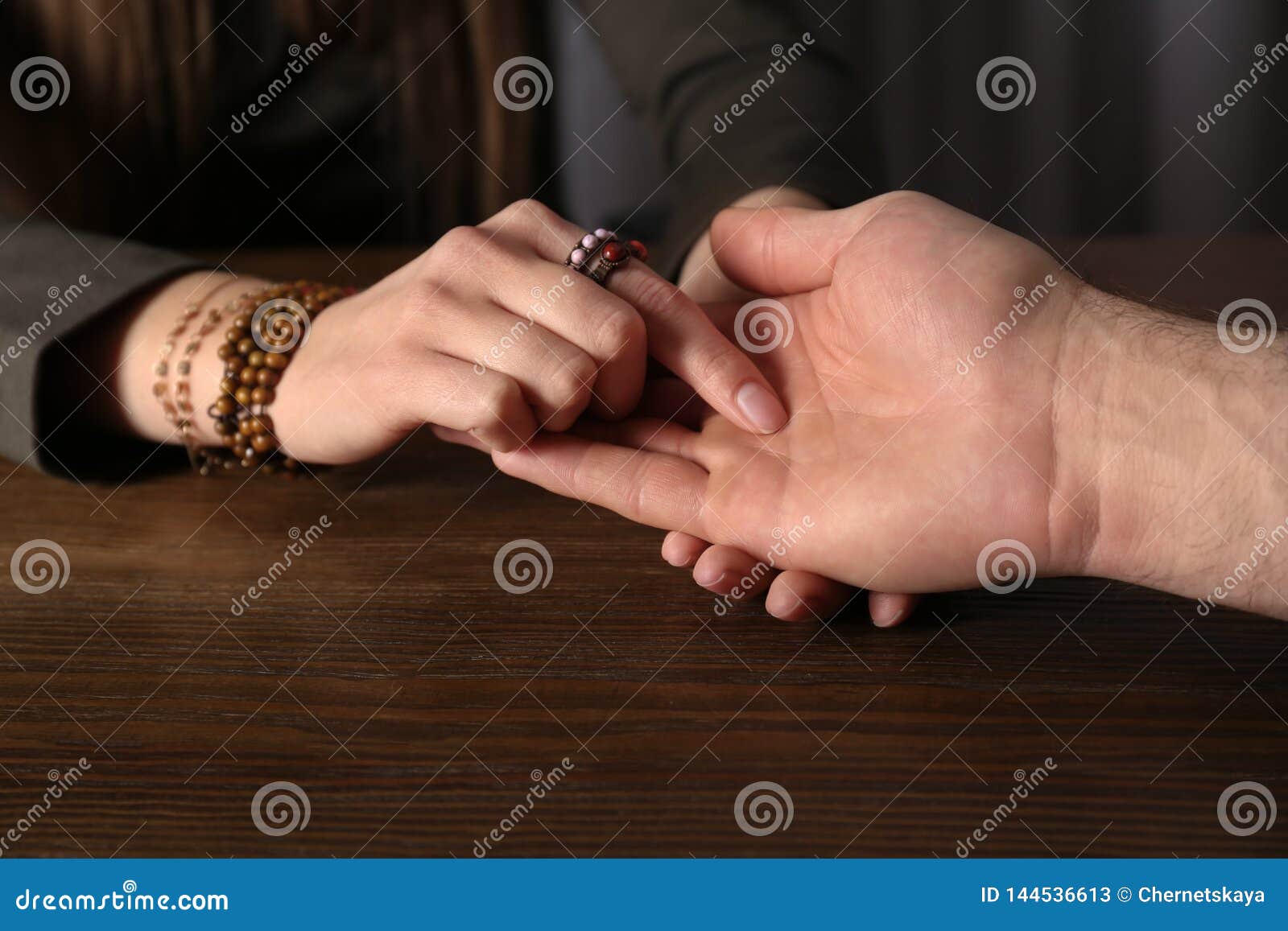 Chiromancer Reading Lines on Man`s Palm at Table Stock Image - Image of ...
