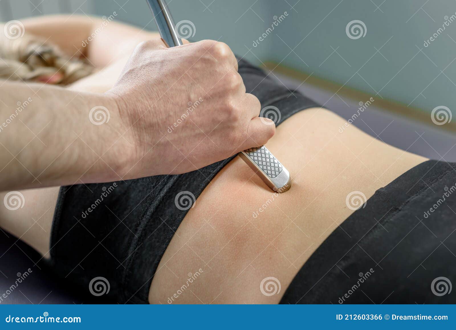 Chiropractic Treatment Using Muscle Scraping IASTM Tool Stock Photo ... Chiropractic Treatment Using Muscle Scraping IASTM Tool Stock Photo ...