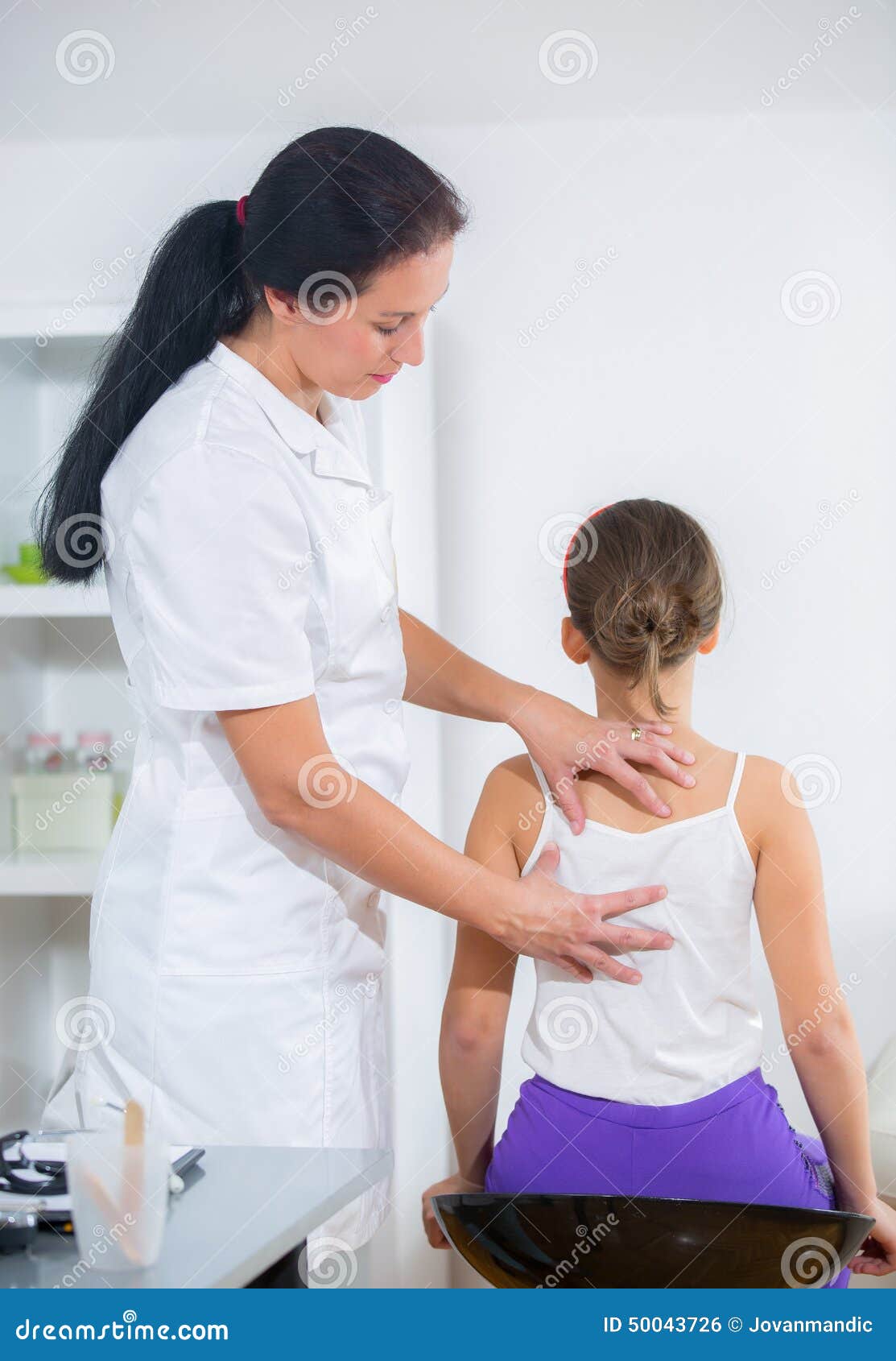 Chiropractor Doing Adjustment on Female Patient Stock Photo - Image of ...