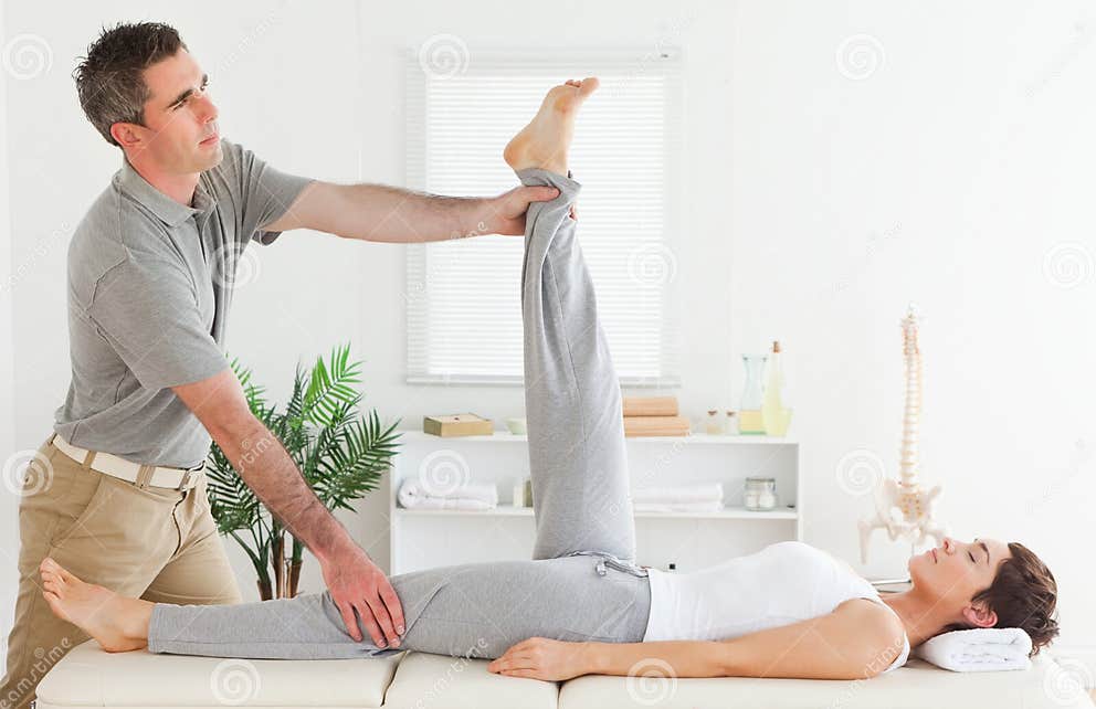 Chiropractor Stretching a Female S Leg Stock Image - Image of ...