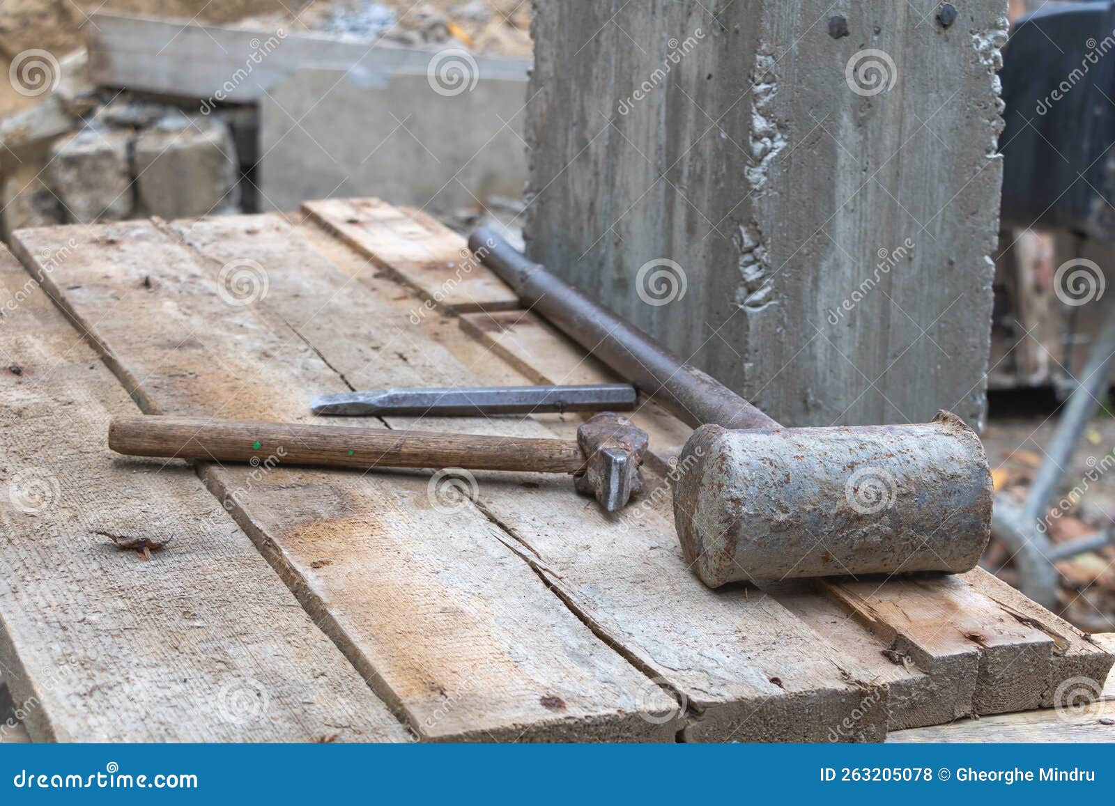 A Chisel and Two Hammers on the Work Table in the Construction Site ...
