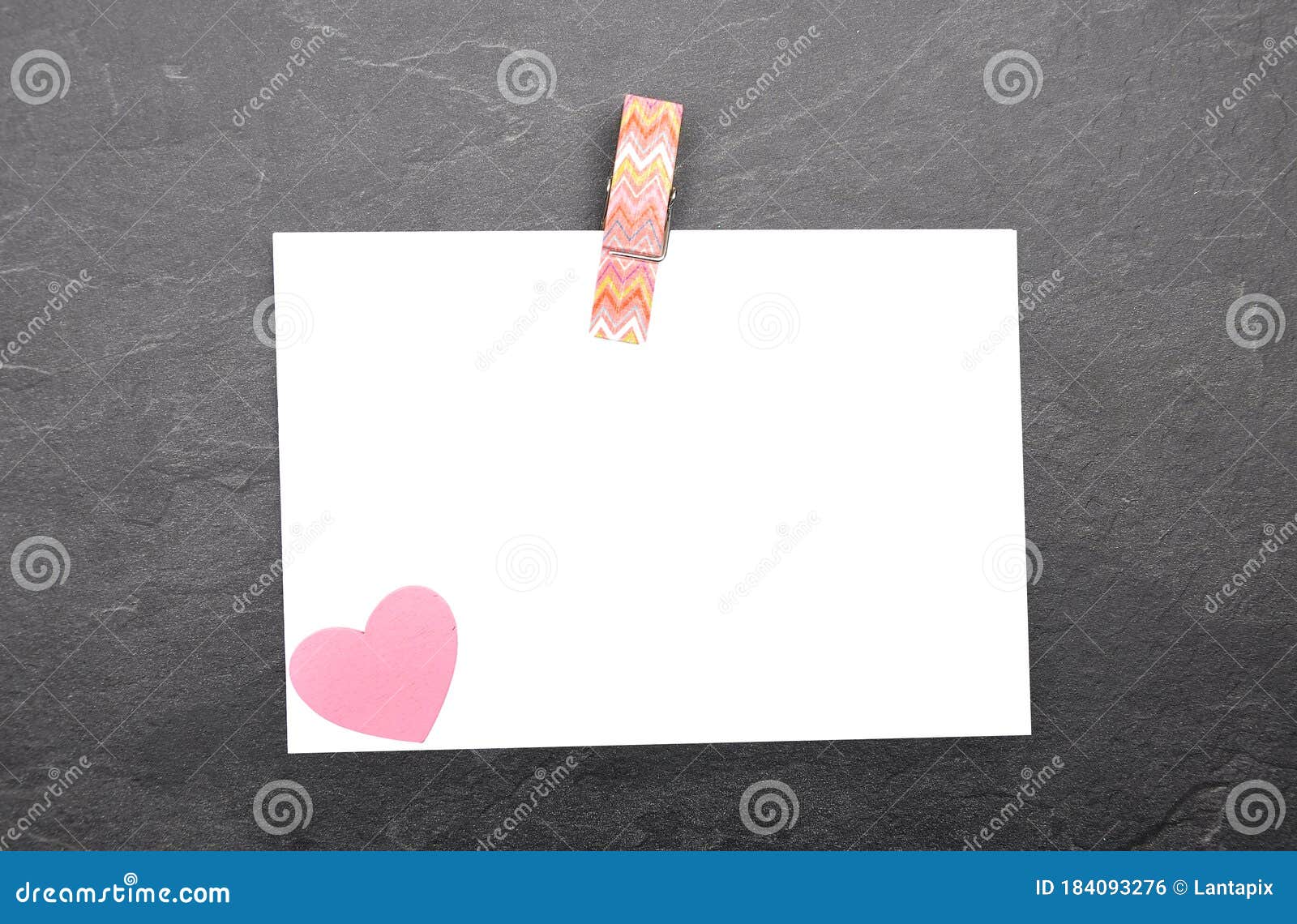 Chit and Wooden Peg on Slate Board Stock Photo - Image of plate ...