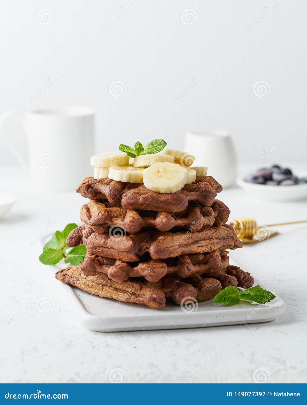 Chocolate Banana Waffles with Maple Syrup on White Table, Side View ...