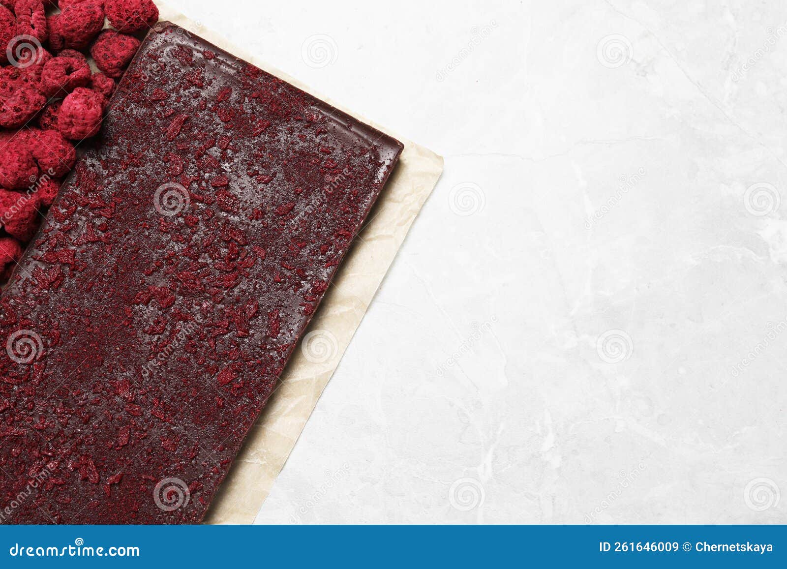 Chocolate Bar with Freeze Dried Raspberries on Light Marble Table, Top ...