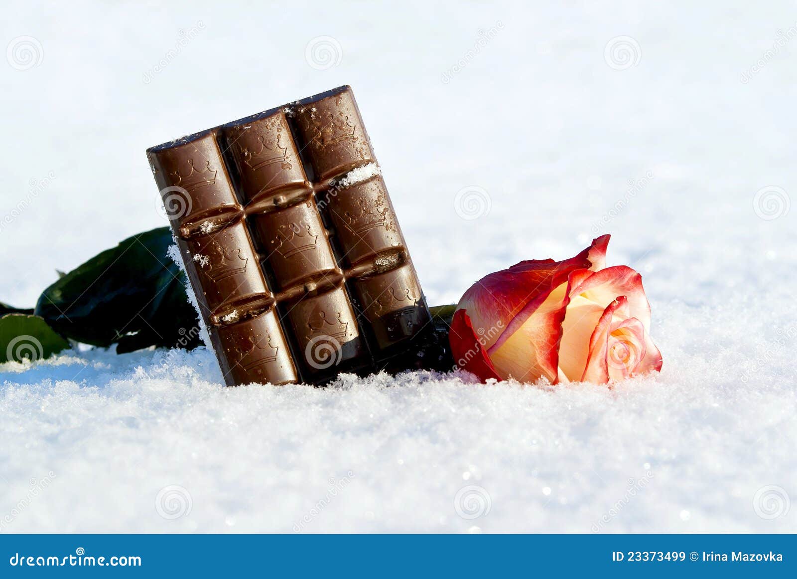 A Chocolate Bar in the Snow with a Rose Stock Image - Image of ...