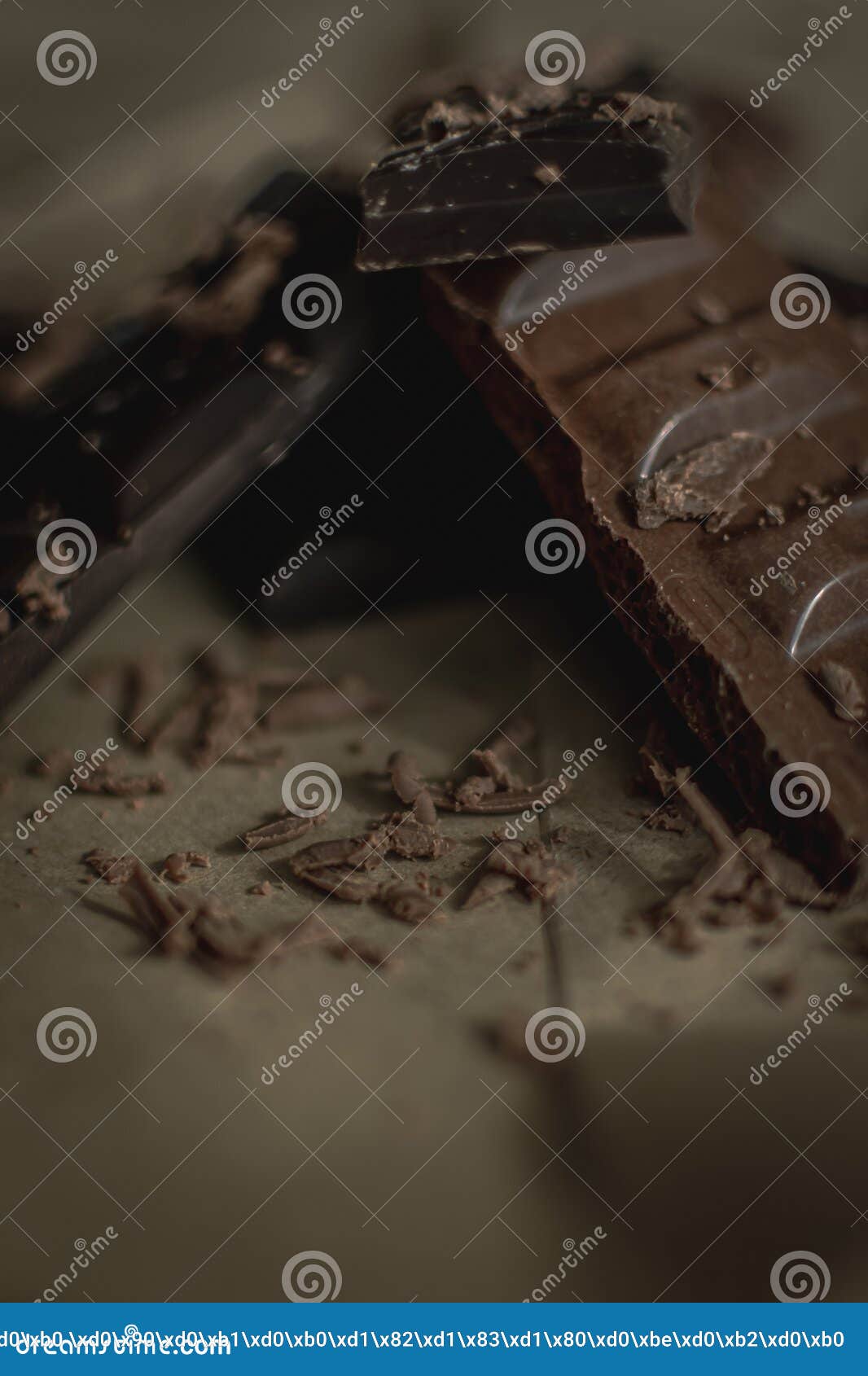 Broken Bars of Different Chocolate Stacked on a Light Background Stock ...