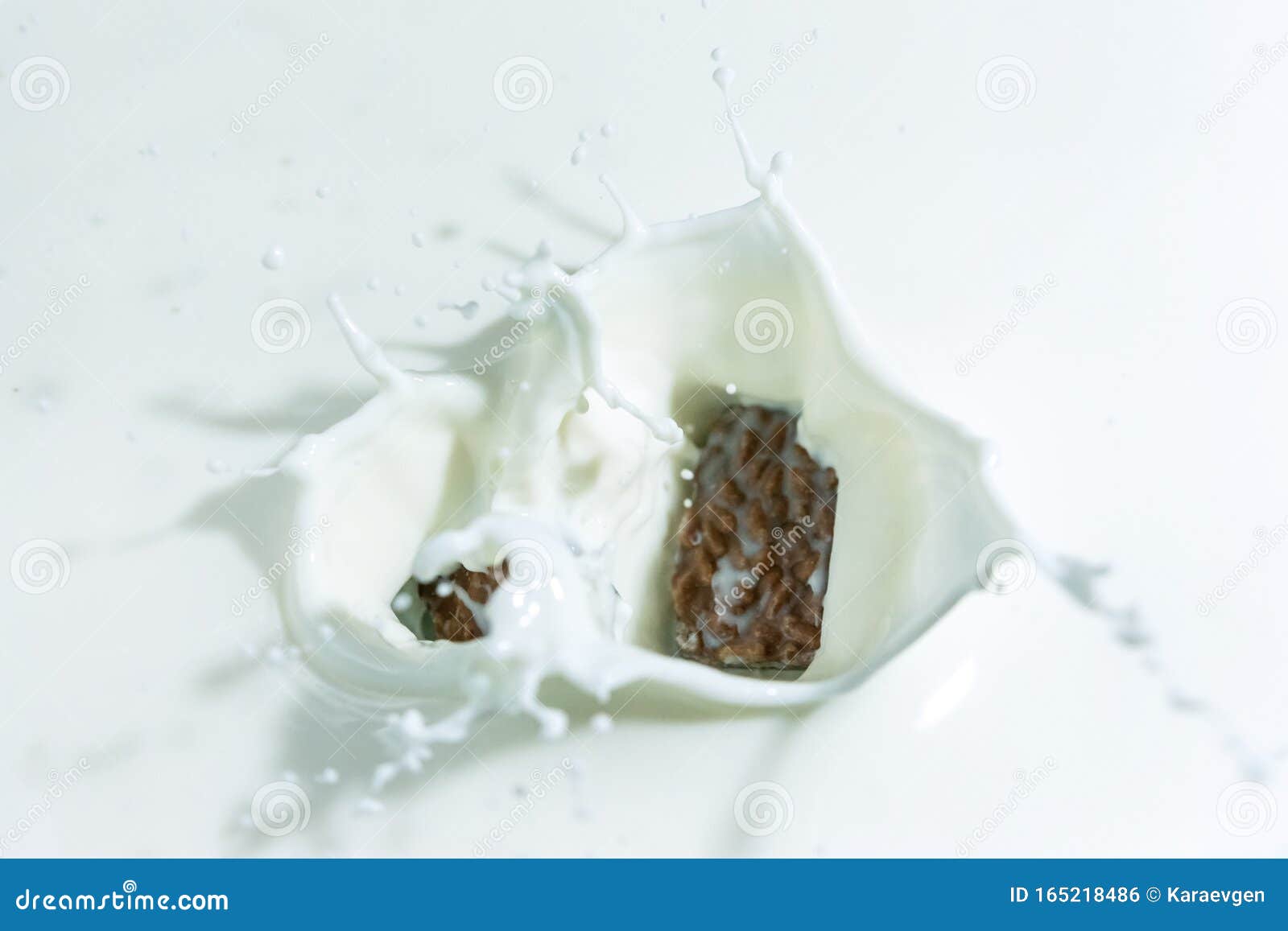 Chocolate Bars Falling into Milk with Splashes Stock Photo - Image of ...