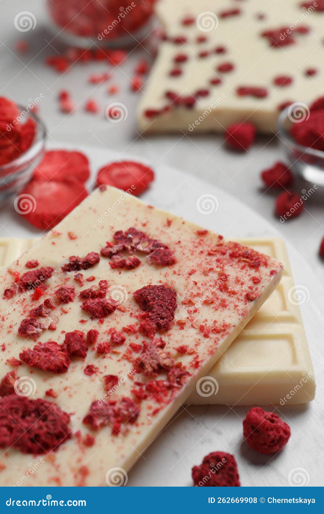 Chocolate Bars with Freeze Dried Raspberries on Light Marble Table ...