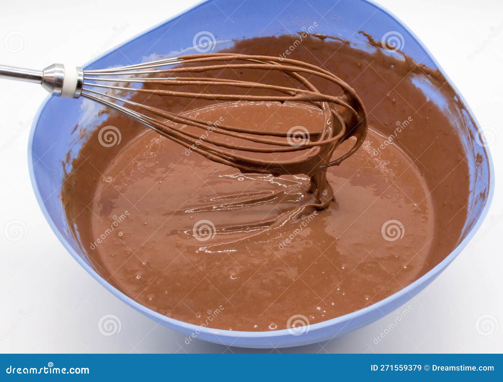 Chocolate batter in a bowl stock image. Image of liquid - 271559379