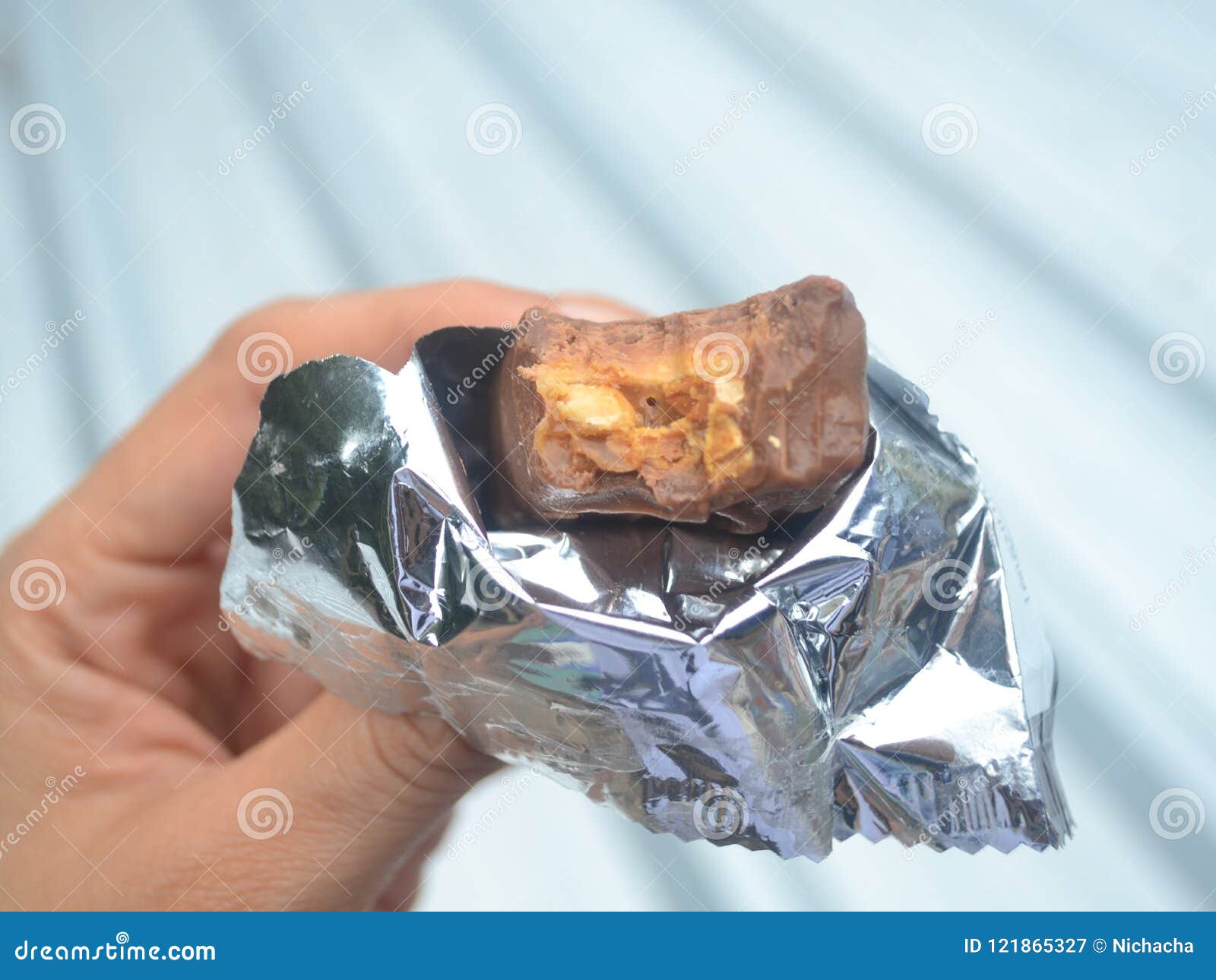 Chocolate with a Bite in Hand Stock Image - Image of healthy, chocolate ...