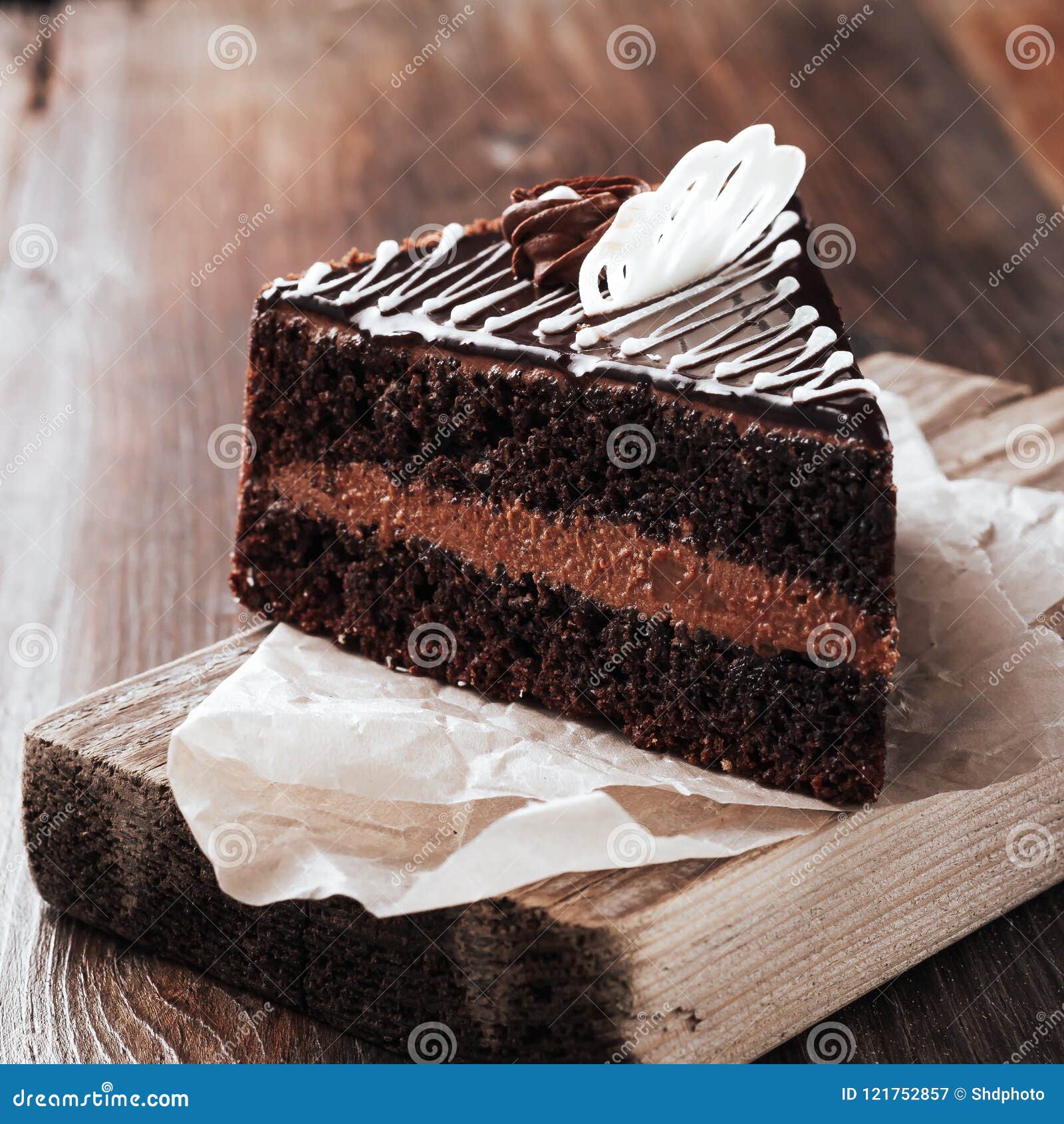 Chocolate Cake Side View on a Cutting Board Rustic Style. Stock Image ...