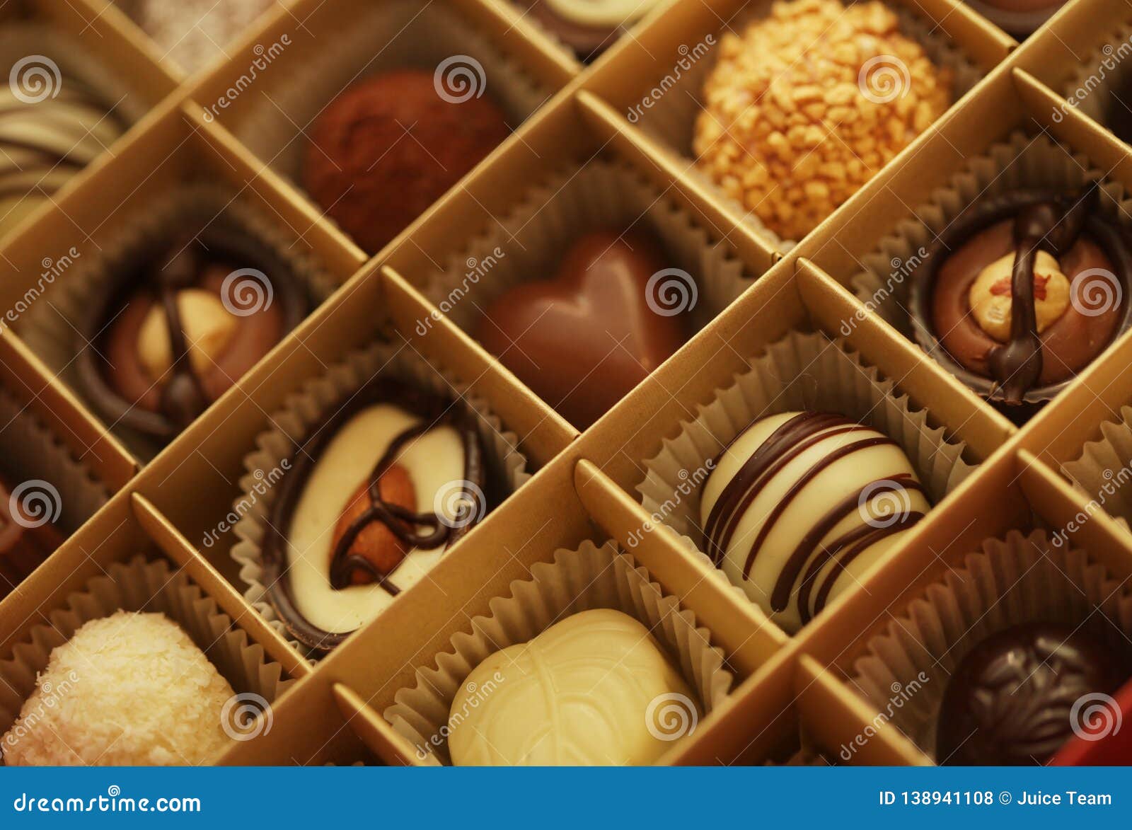 Chocolate candies in a box stock photo. Image of candy - 138941108