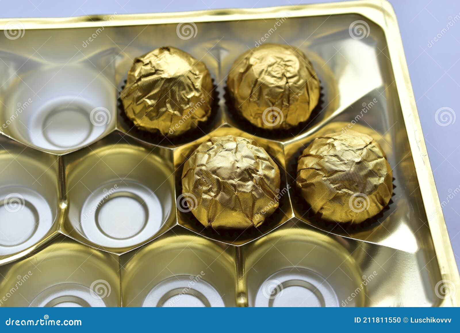 Chocolate Candies in a Box in a Gold Wrapper Stock Photo - Image of ...