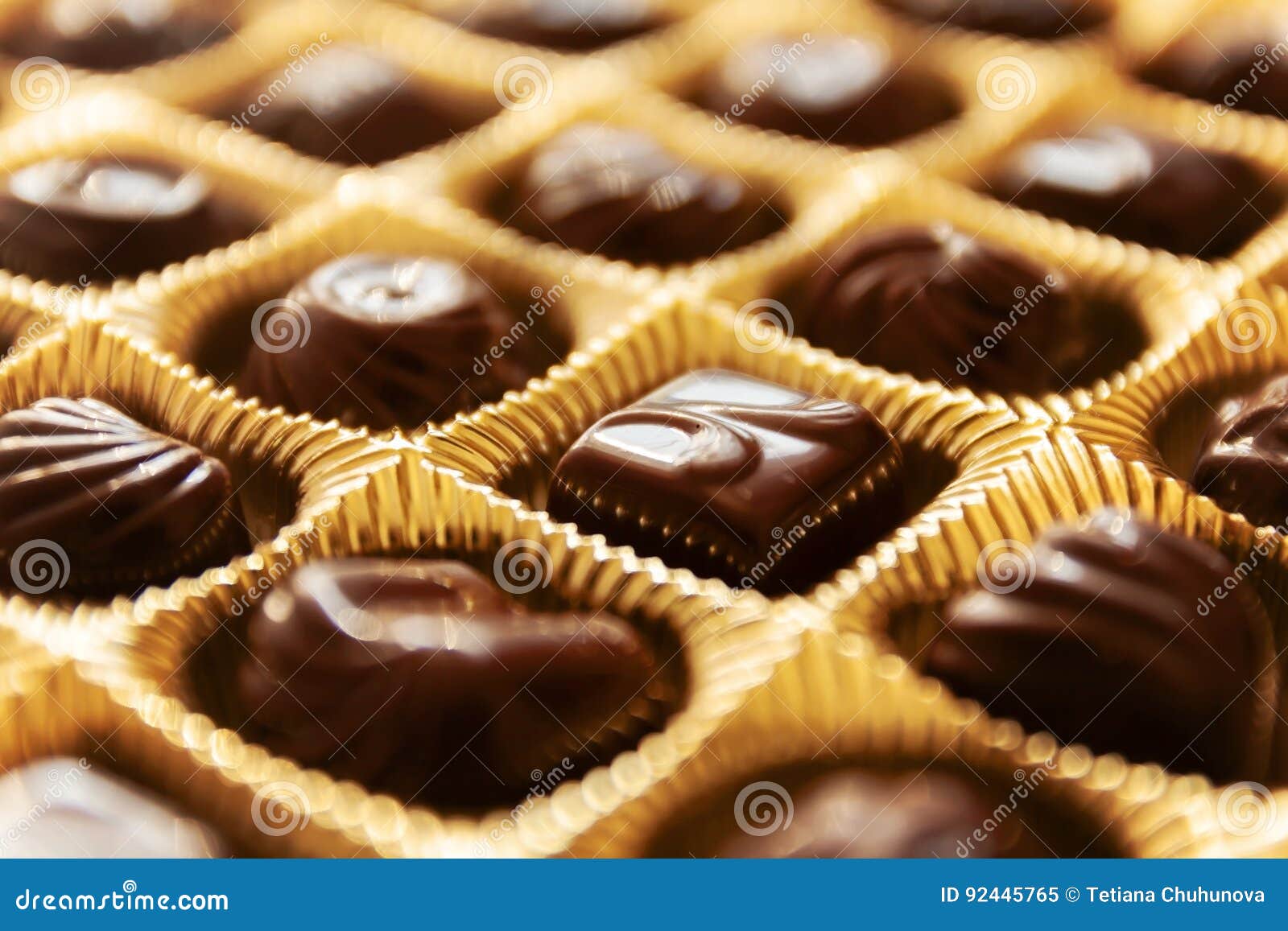 Chocolate Candies of Different Shapes in a Gold Box, a Perspective View ...