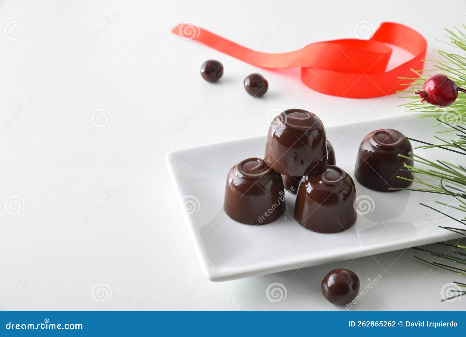 Chocolate Candies on Plate on White and Red Bow Stock Photo - Image of ...