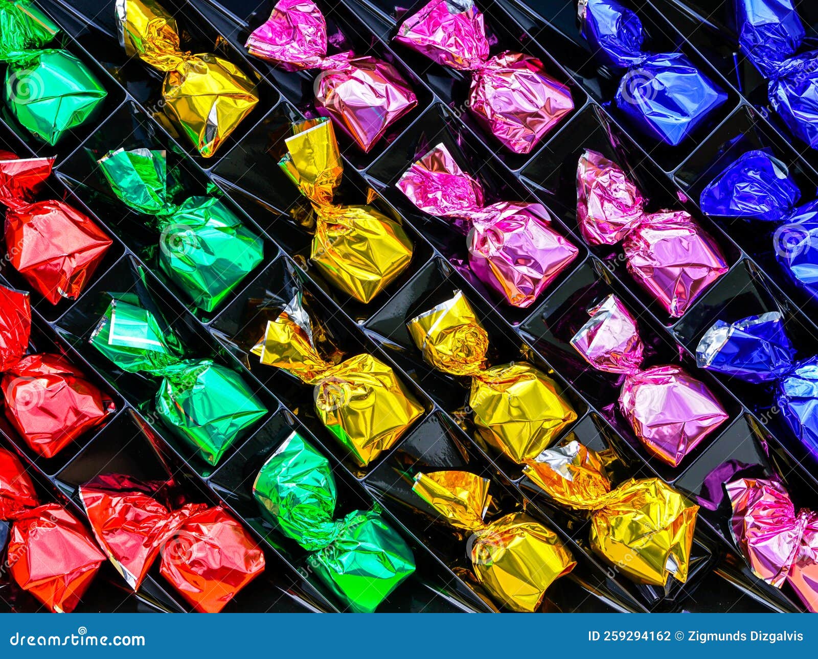 Chocolate Candies in Shiny Wrapper of Different Colors in Regular Order ...