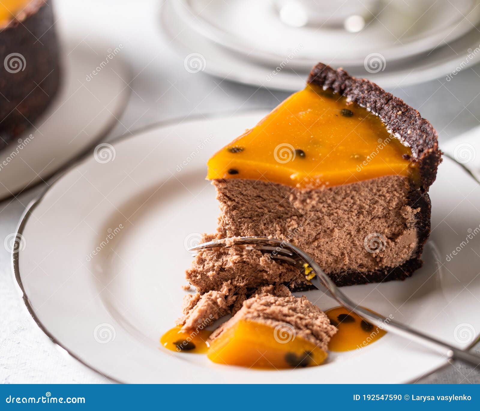 Chocolate Cheesecake with Mango and Passion Fruit. Slice of Mango Stock ...