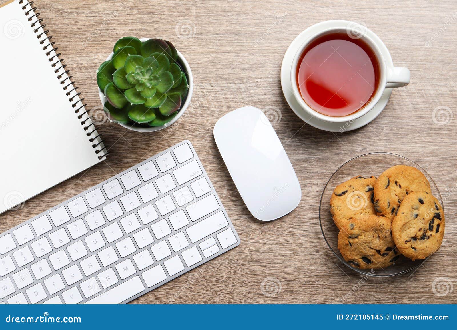 Chocolate Chip Cookies, Tea and Keyboard on Wooden Table at Workplace ...