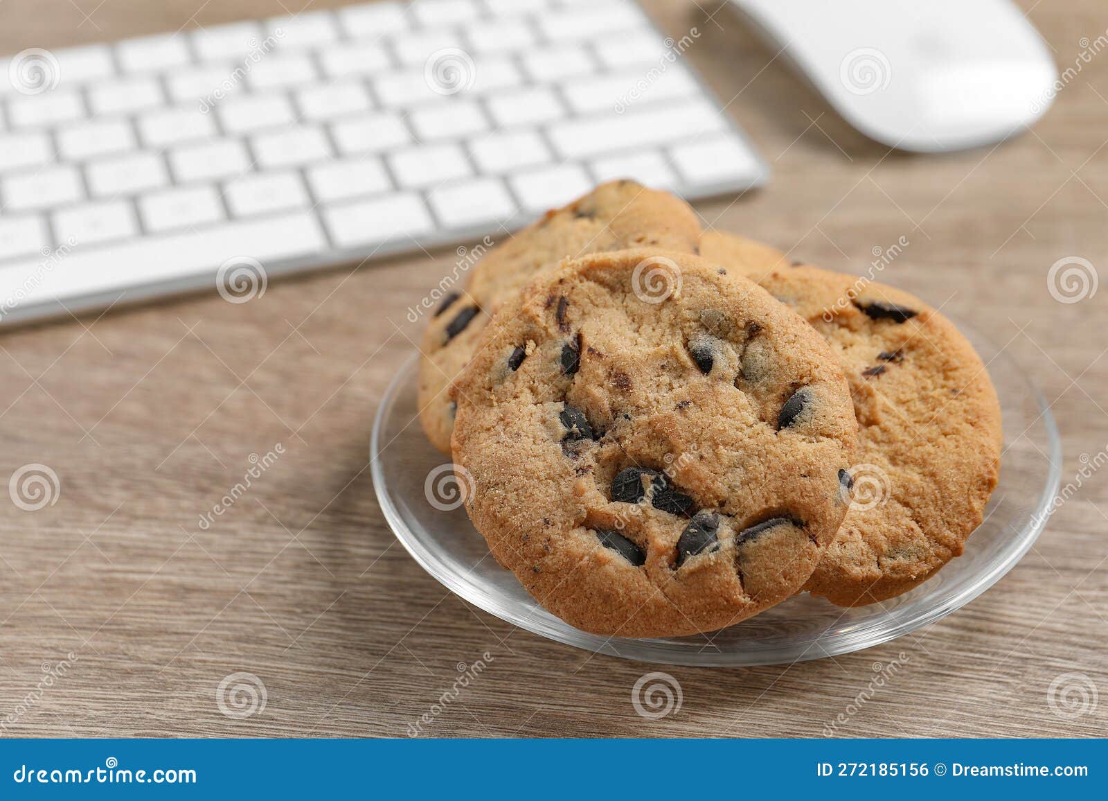 Chocolate Chip Cookies on Wooden Table at Workplace, Closeup Stock ...