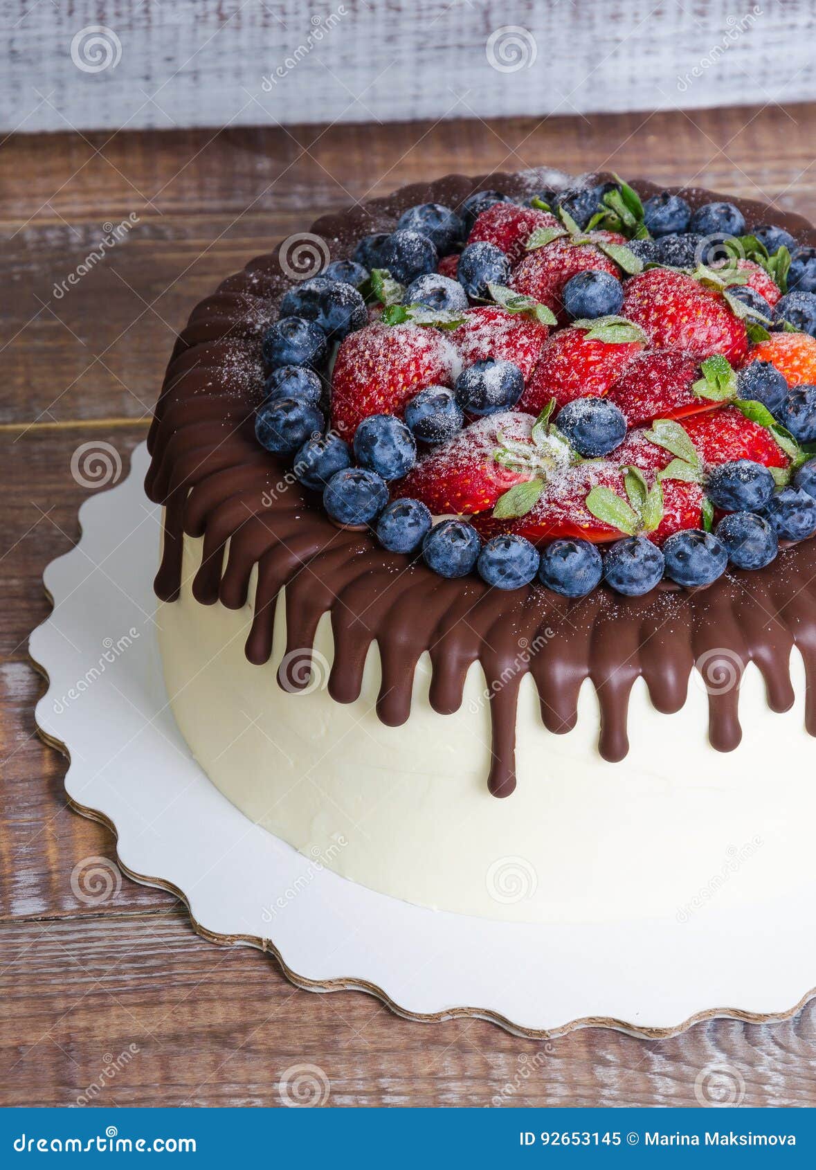 Chocolate Color Drip Cake with Blueberries and Strawberries and Stock ...