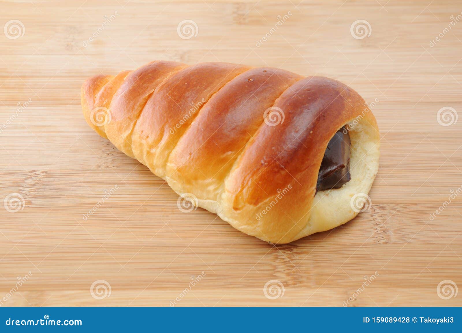 Chocolate Cornet Butter Bread Roll on Cutting Board Stock Photo - Image ...