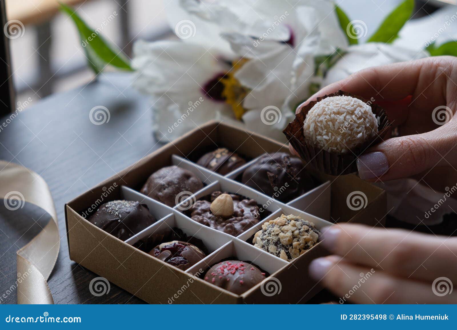 Chocolate Craft Candy in Female Hand and Candy Box Stock Photo - Image ...