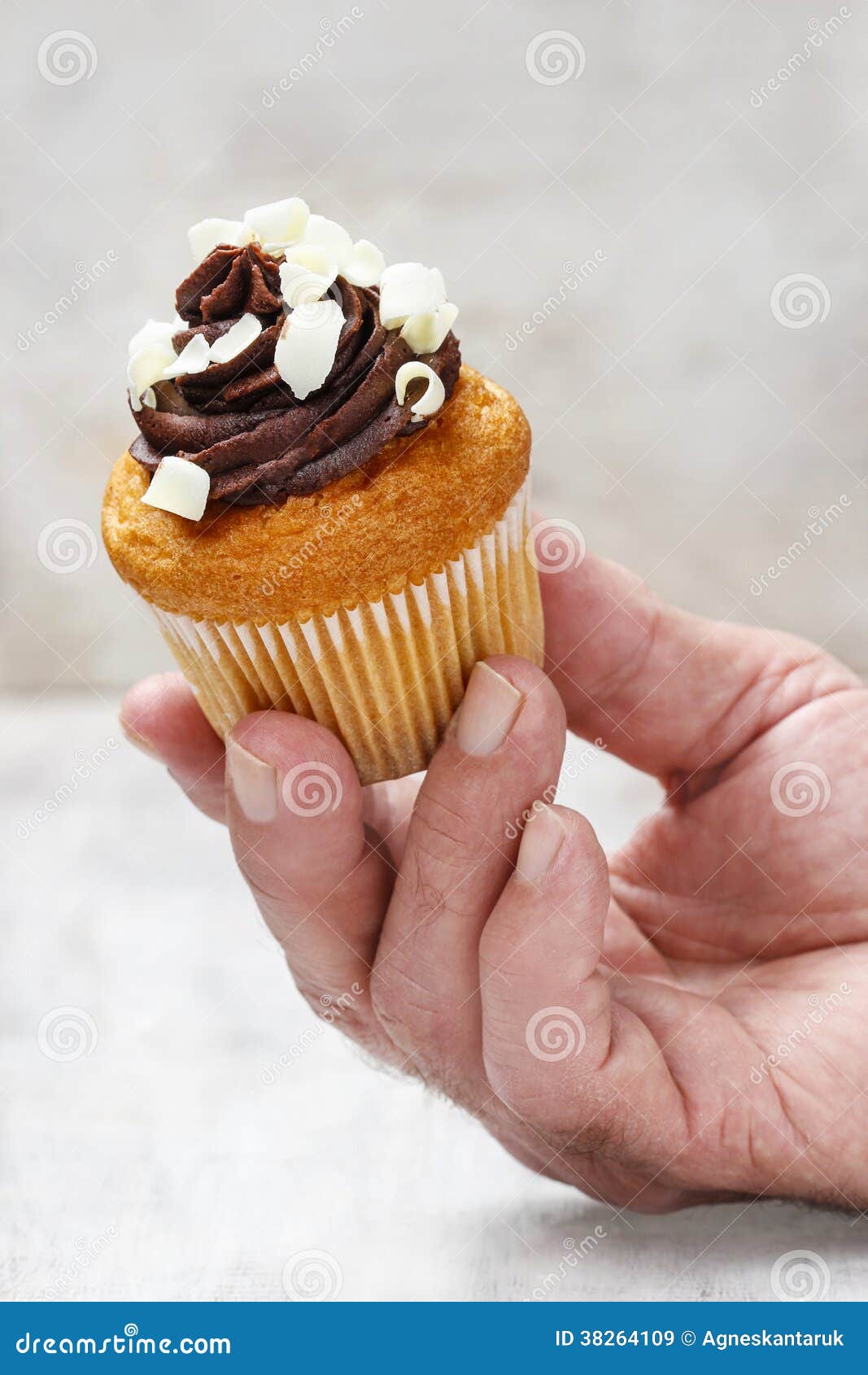 Chocolate cupcake in hand stock image. Image of aromatic - 38264109