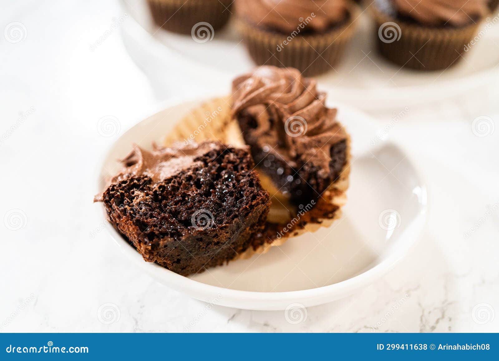 Chocolate Cupcake Sliced in Half on Kitchen Counter Stock Photo - Image ...