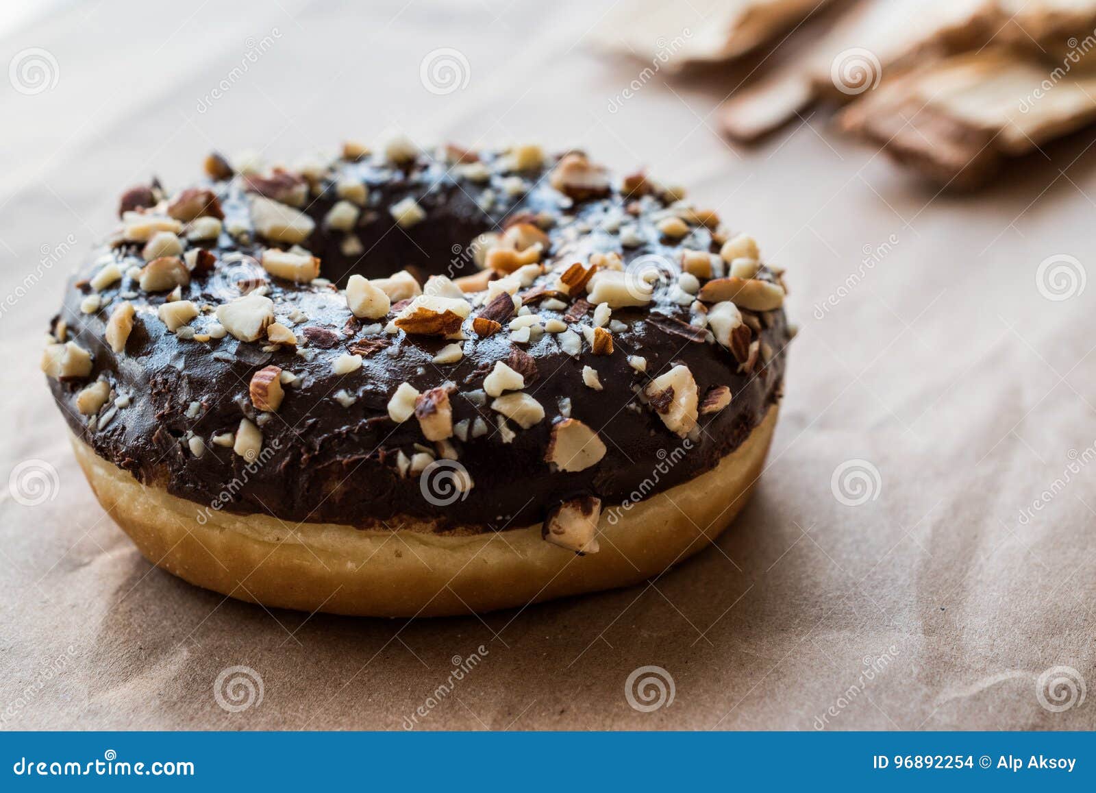 Chocolate Donut with Diced Hazelnut Pieces. Stock Photo - Image of ...