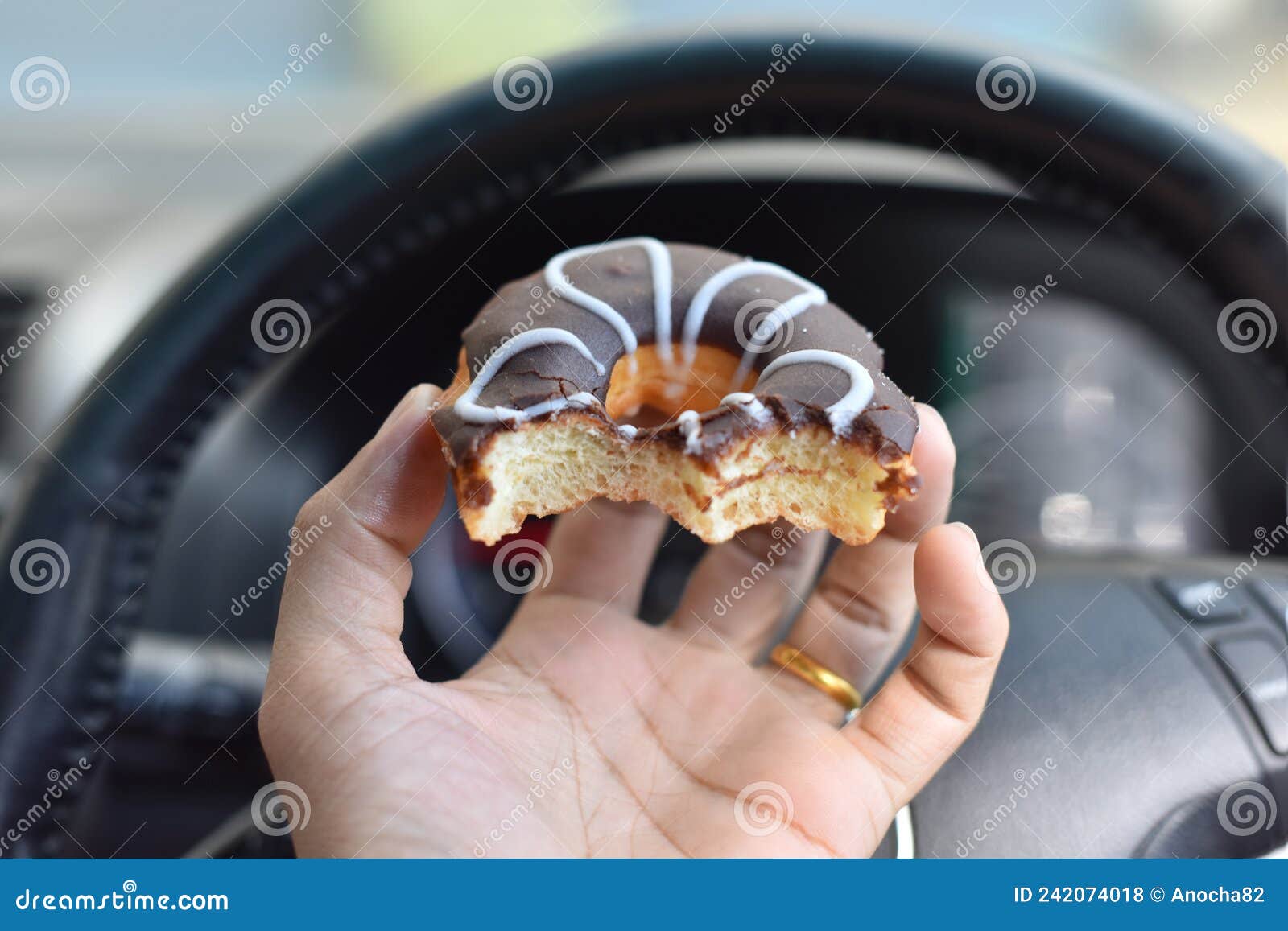 Chocolate Donuts in Hand in Car Driving Stock Photo - Image of eating ...