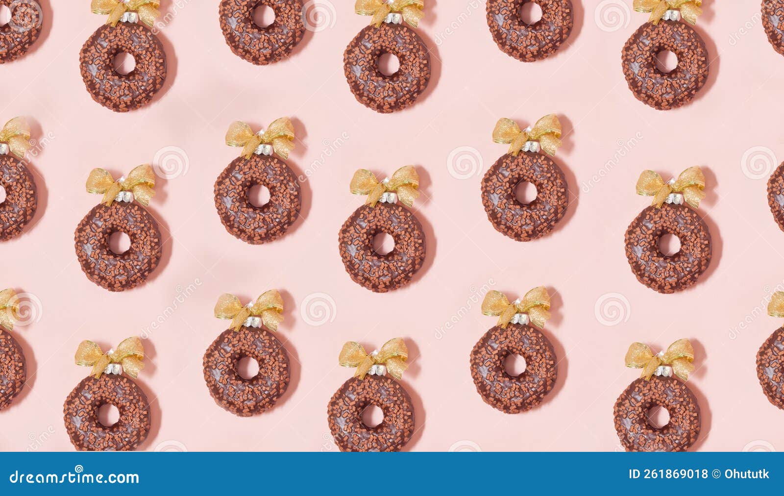 Chocolate Donuts Pattern with Golden Bows on Pink Background. Christmas ...