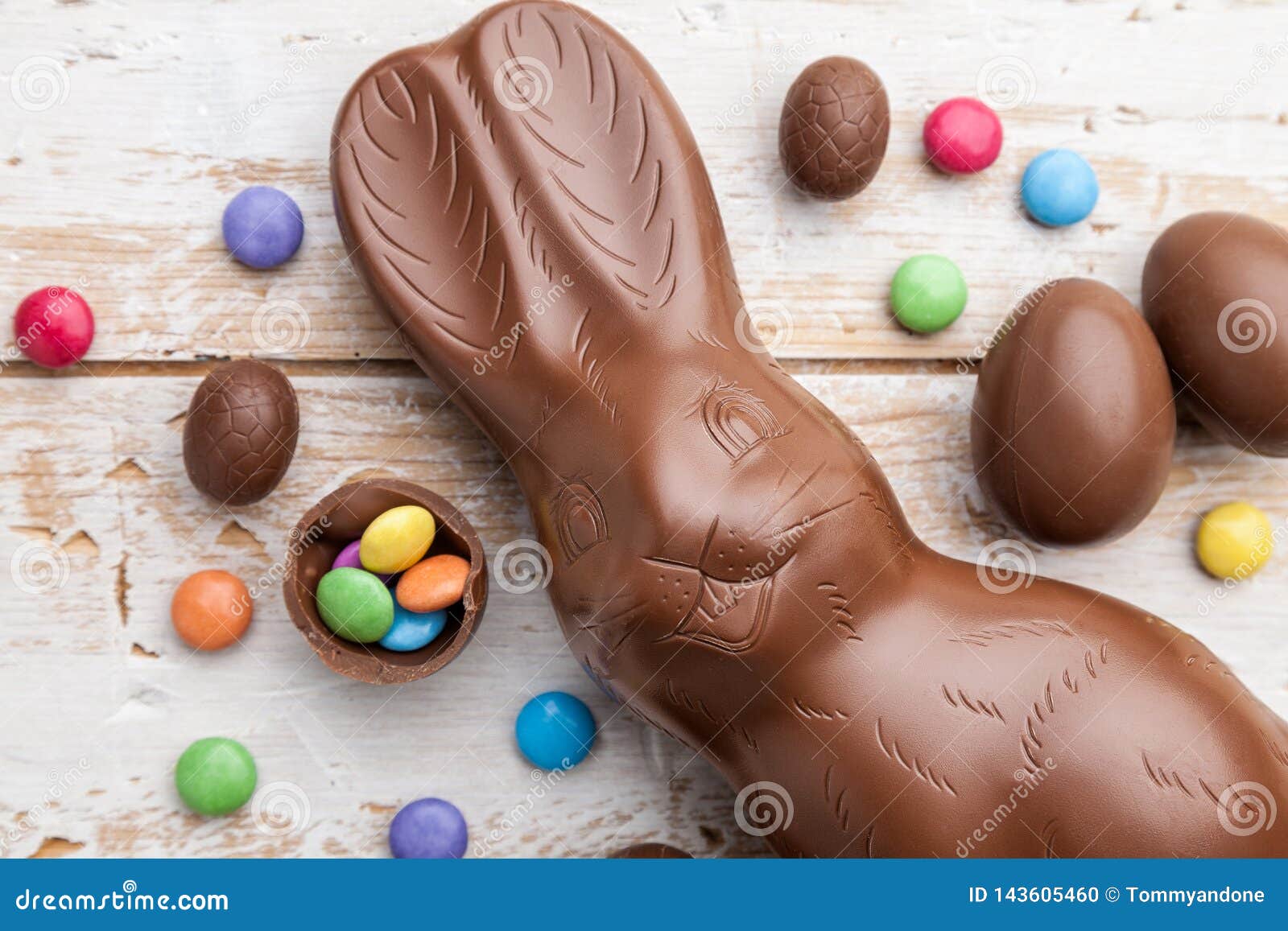 Chocolate Easter Bunny, Eggs and Sweets on Rustic Background Stock ...
