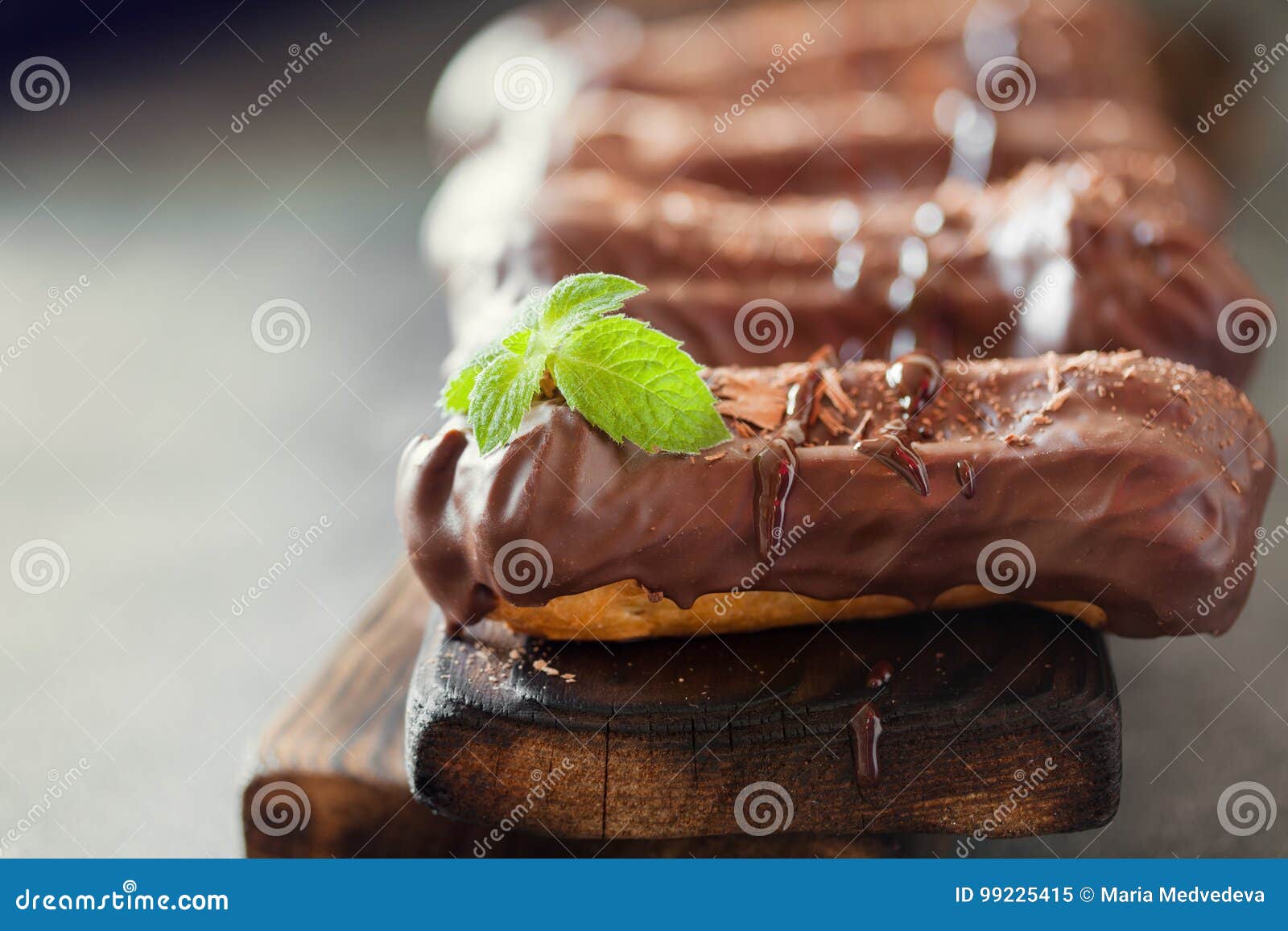 Chocolate Eclair Decorated with Mint and Melted Chocolate Stock Image ...