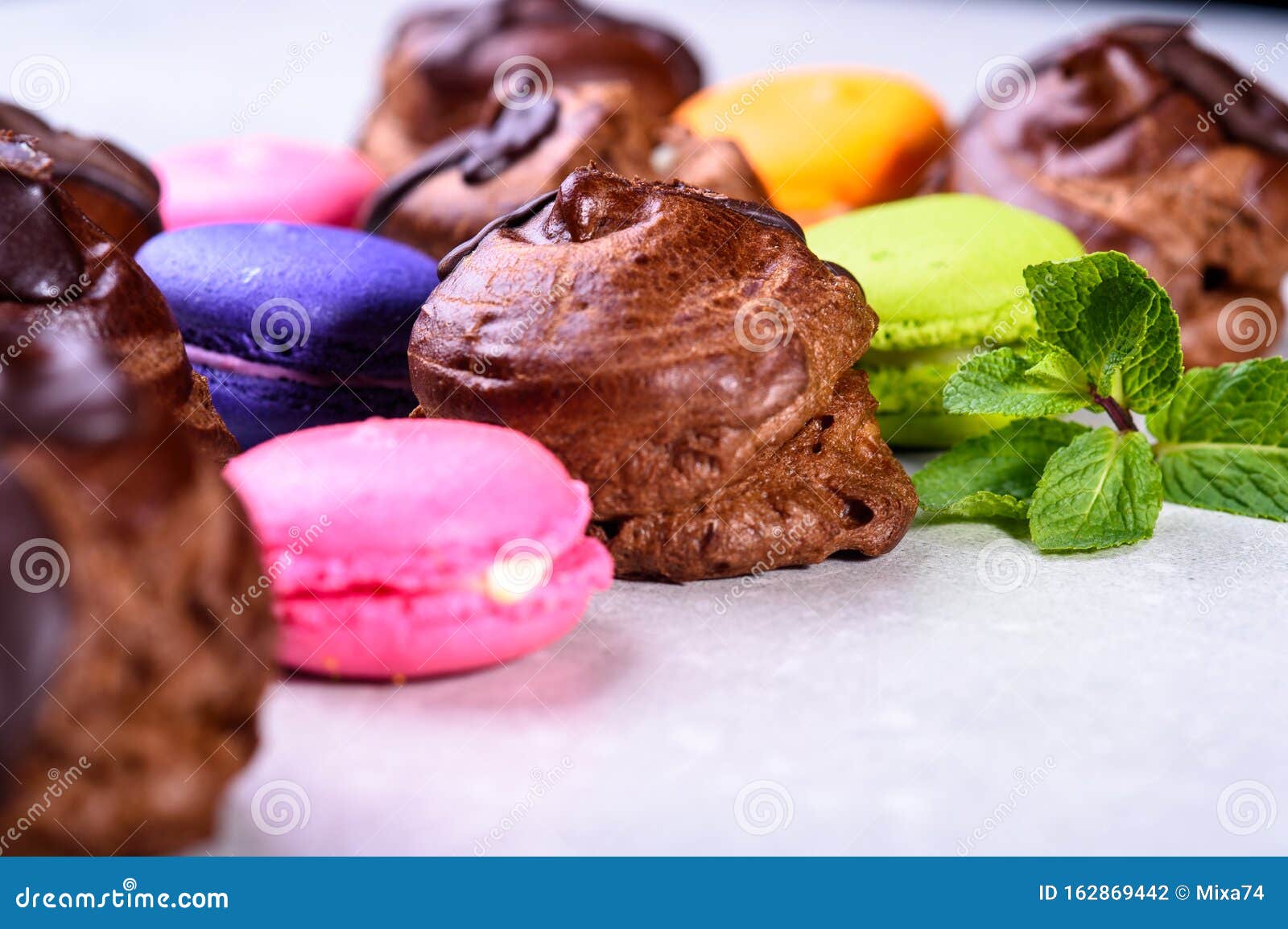 Chocolate Eclairs and Macaroons for the Restaurant Menu1 Stock Photo ...