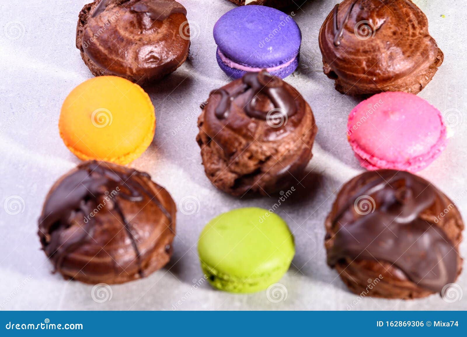 Chocolate Eclairs and Macaroons for the Restaurant Menu5 Stock Photo ...