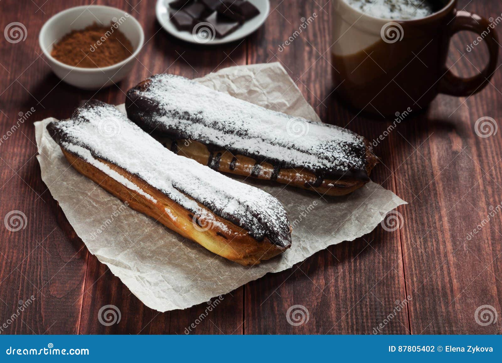 Chocolate Eclairs on Parchment Paper Stock Photo - Image of puff ...