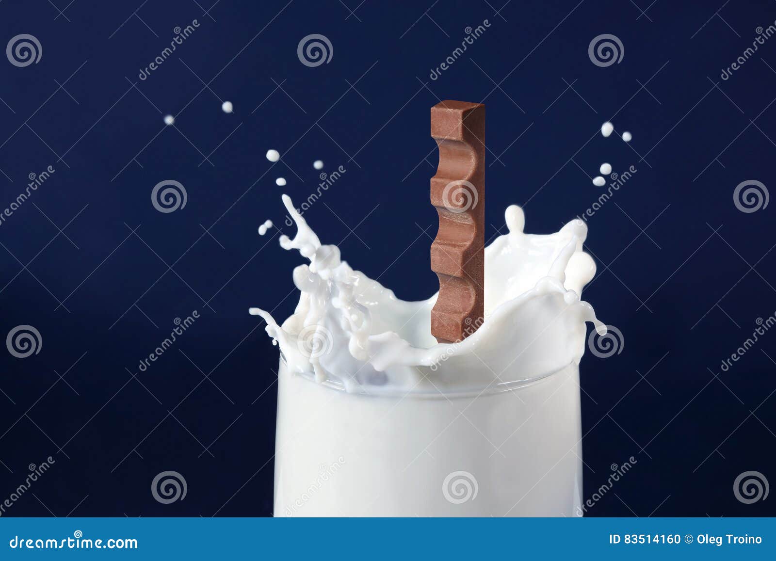 Chocolate Falling into Milk on Blue Background Stock Photo - Image of ...
