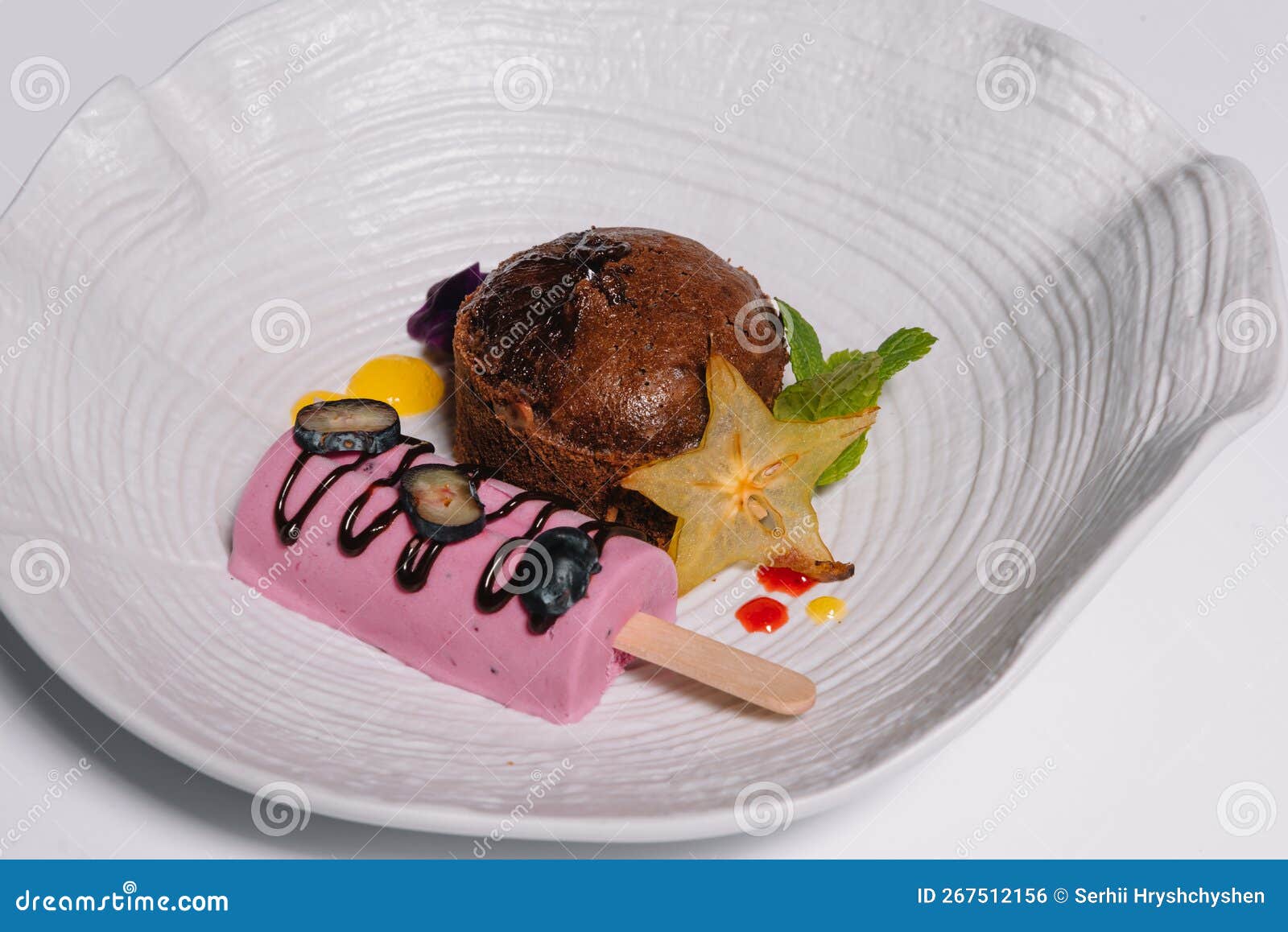 Chocolate Fondant with Vanilla Ice Cream and Raspberry Sauce. Stock ...