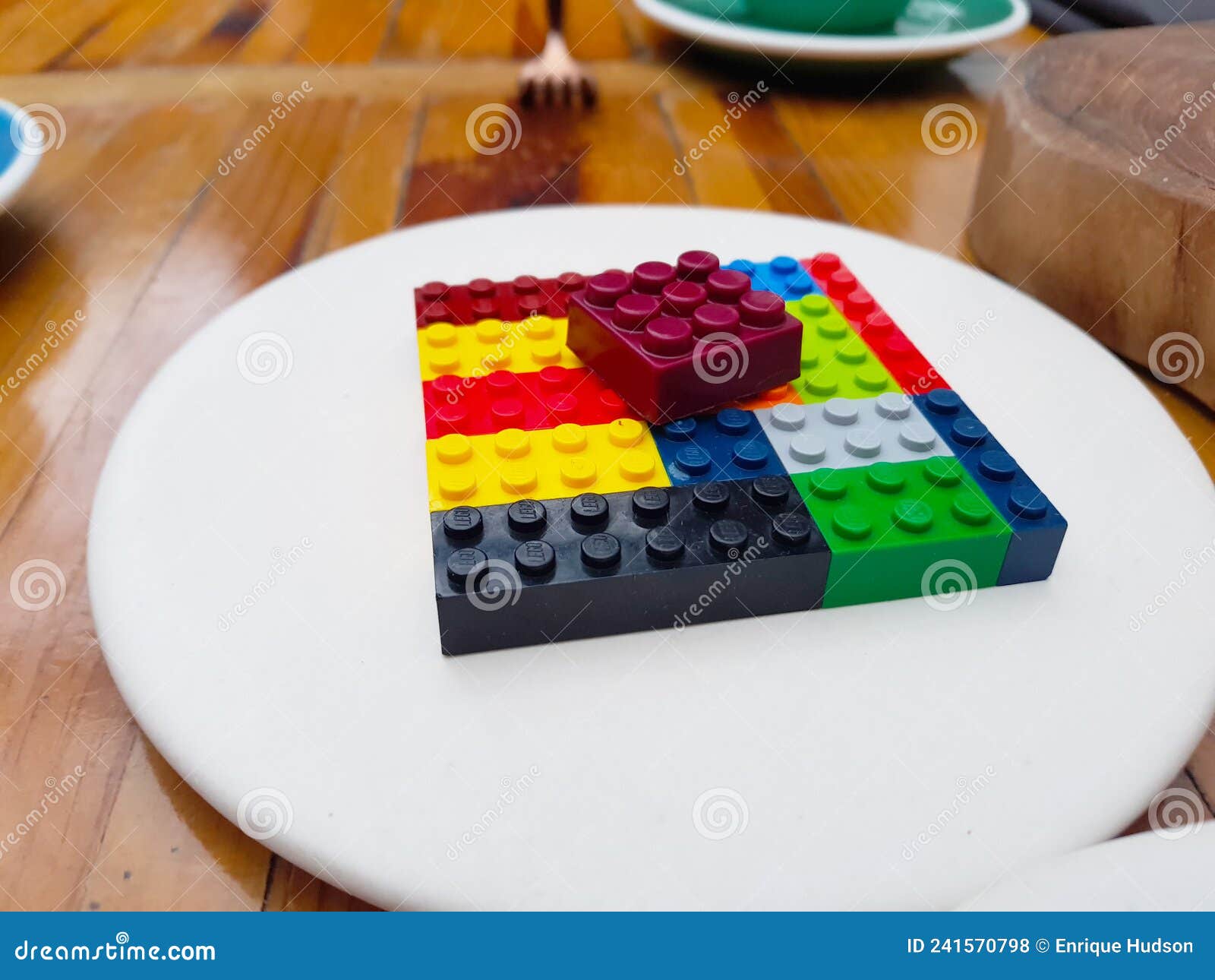 Chocolate in the Form of a Buildable Brick on a Base of Plastic Pieces ...