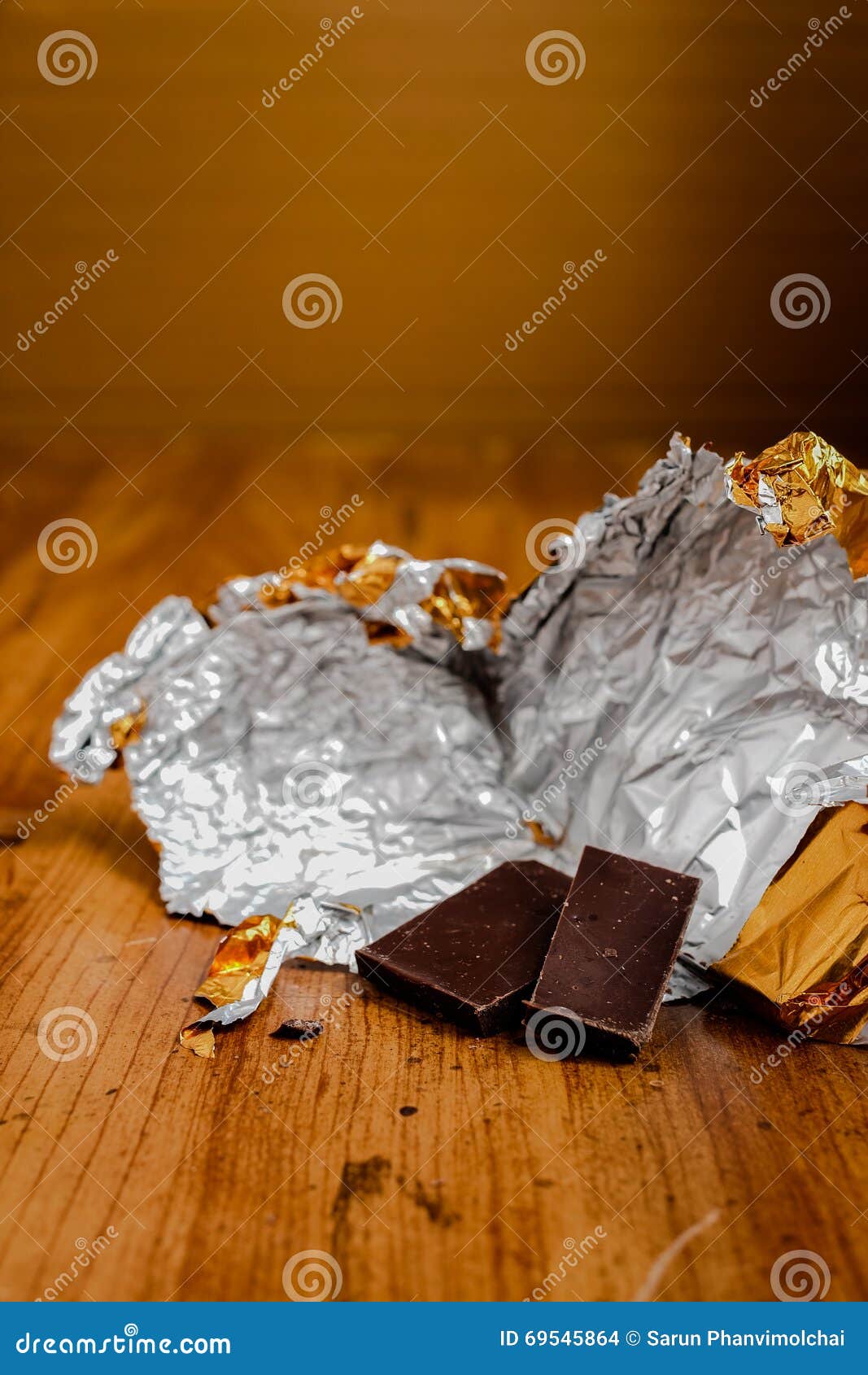 Chocolate with gold foil stock photo. Image of food, calorie - 69545864