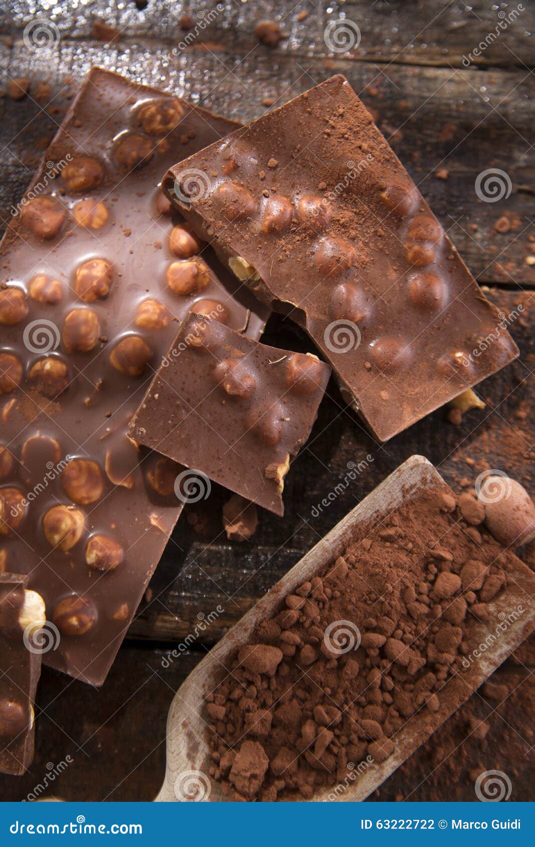 Chocolate with hazelnuts stock photo. Image of milk, square - 63222722