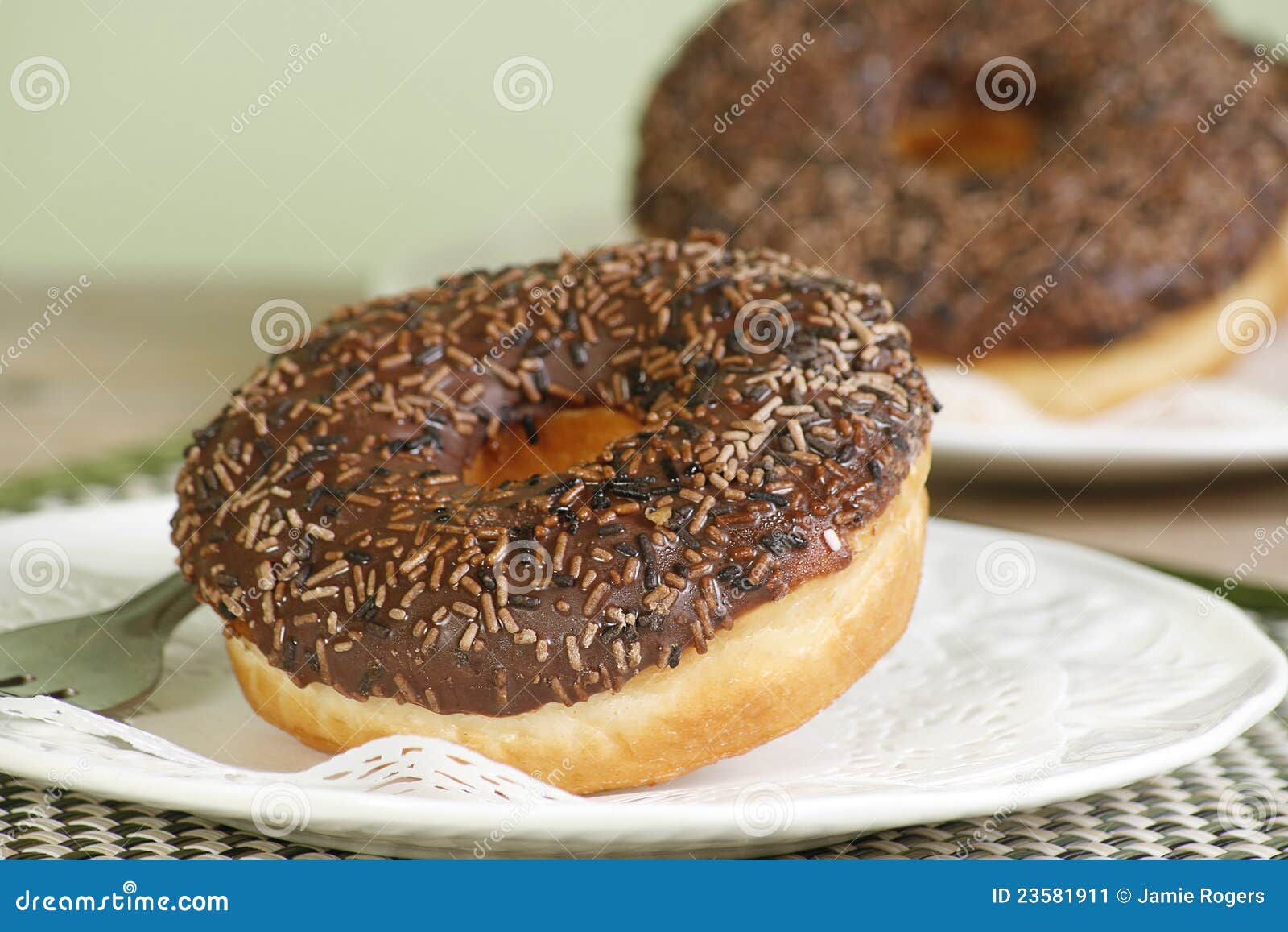Chocolate iced doughnuts stock image. Image of donut - 23581911