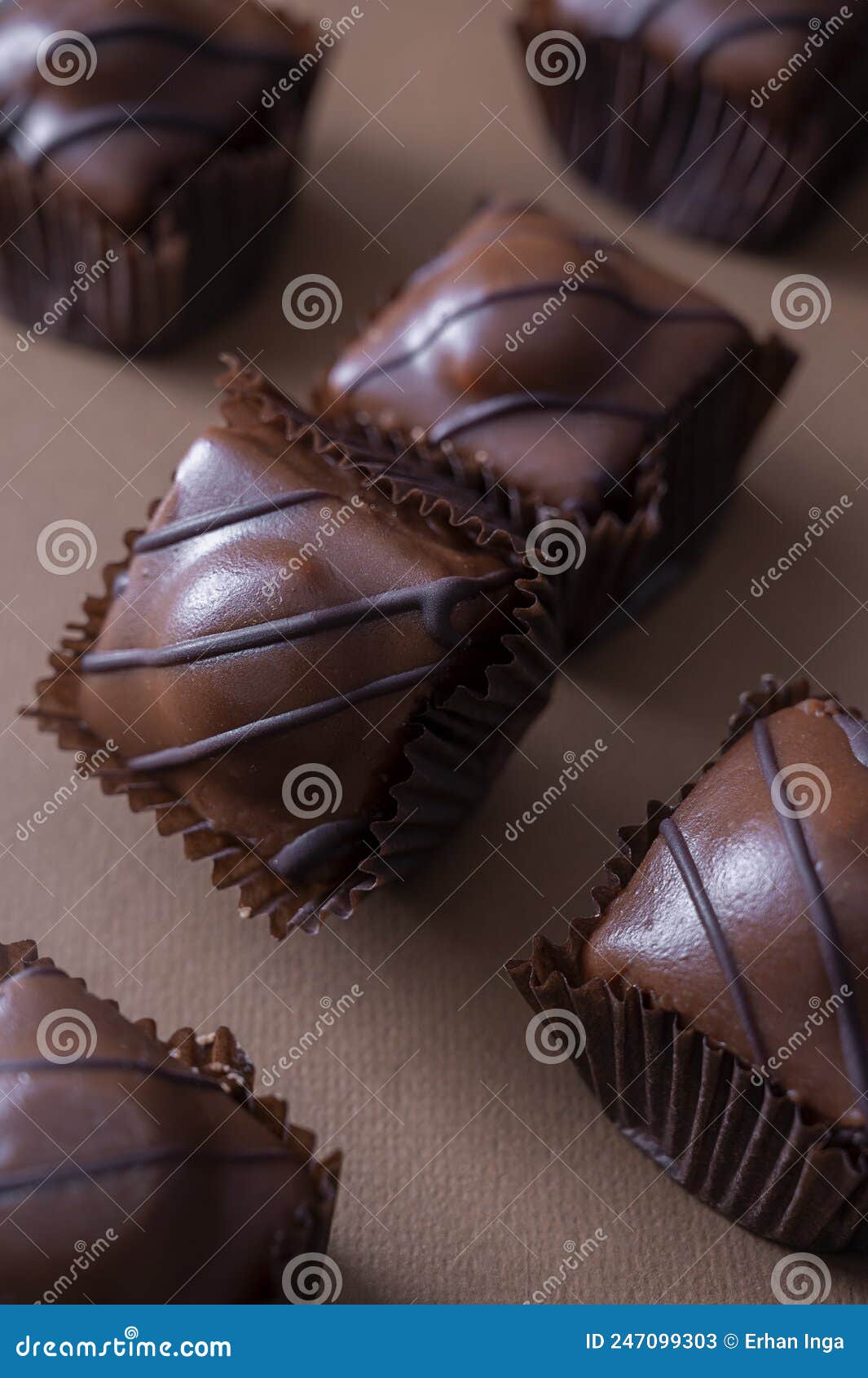 Chocolate Mini Cakes on Brown Background. Chocolate Abstract Background ...